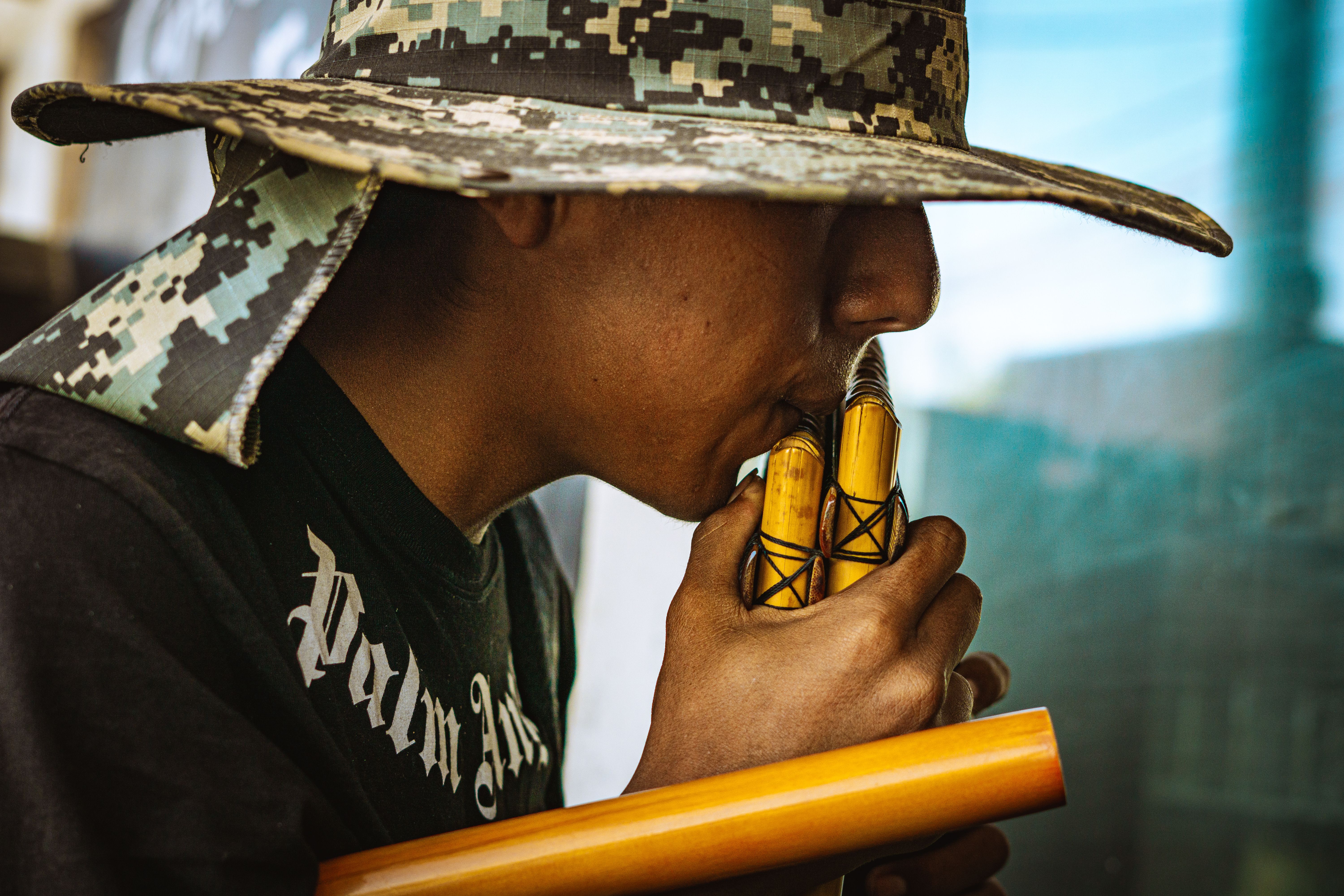 A Man Playing a Pan Flute · Free Stock Photo