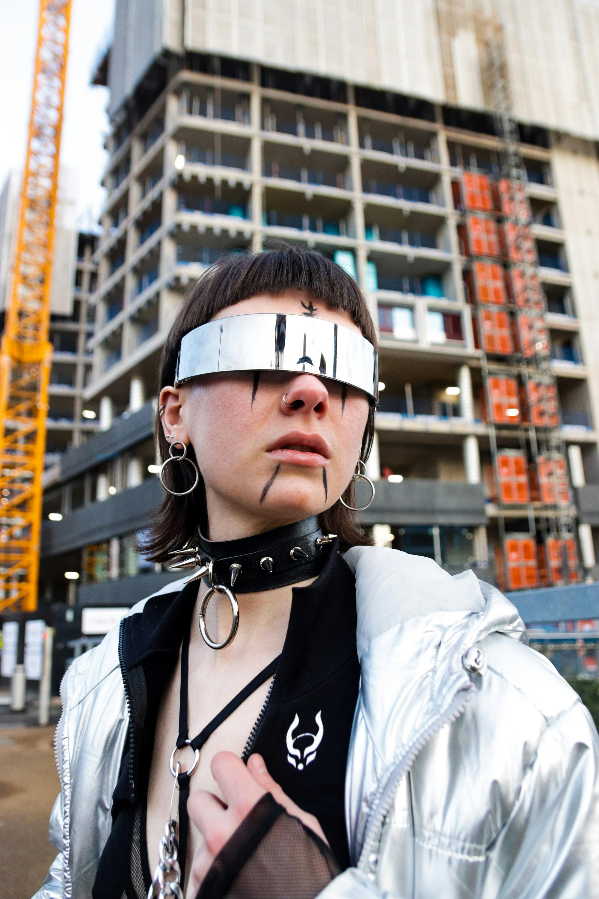 Young Woman in a Punk Wear and Blindfold on a Construction Site · Free ...