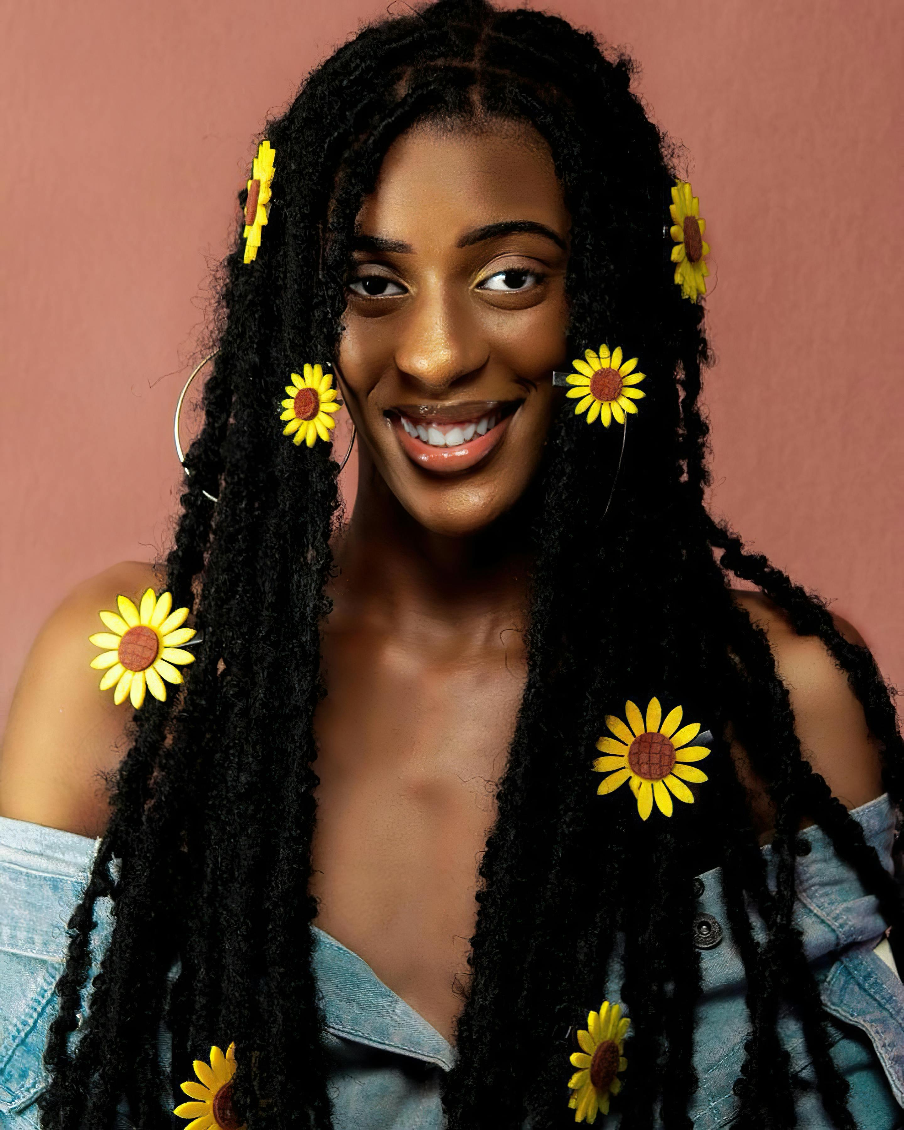 Beautiful African model with sunflower on her head · Free Stock Photo