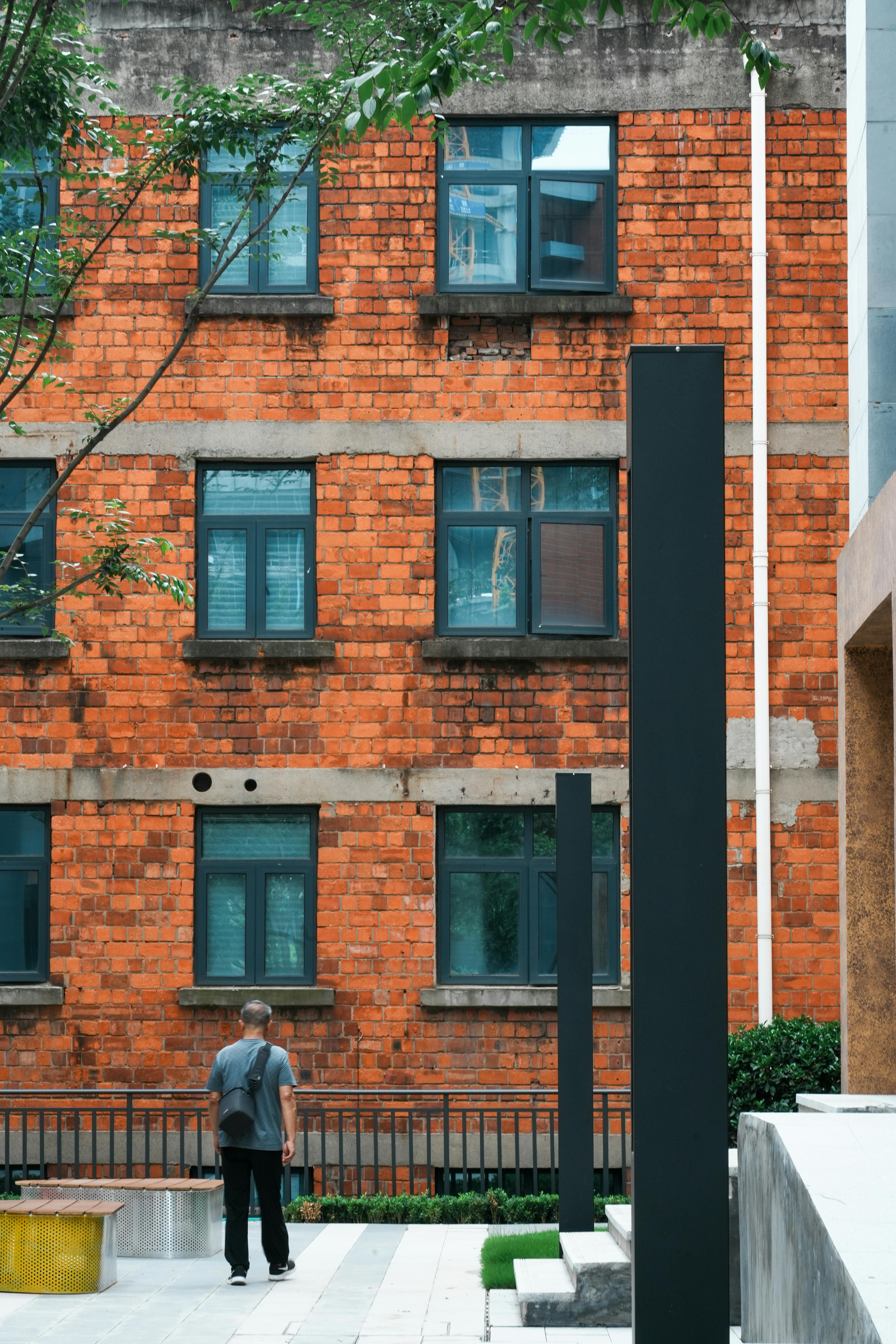 Man Standing near Building · Free Stock Photo