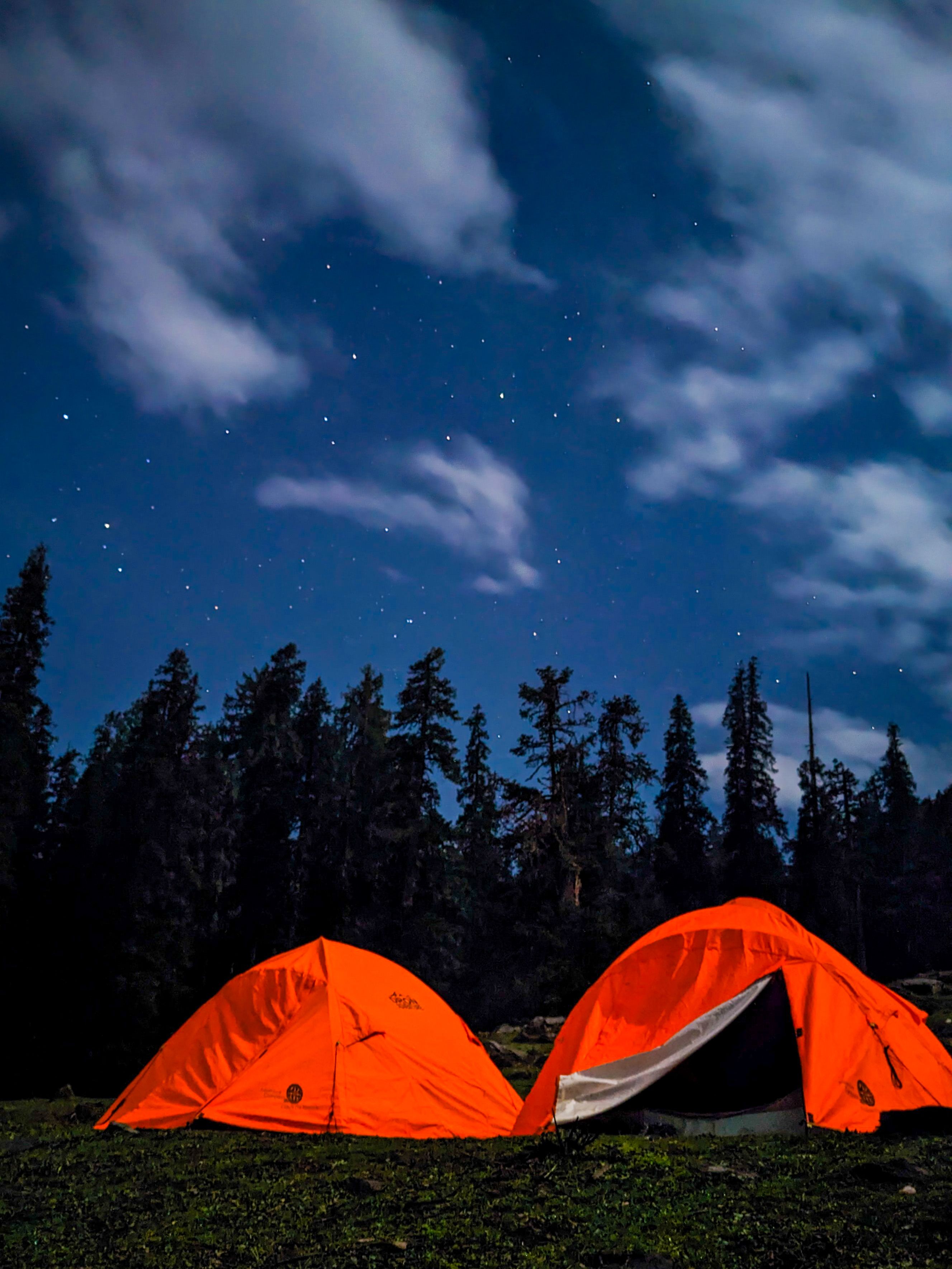 Two orange tents are set up under a starry sky · Free Stock Photo