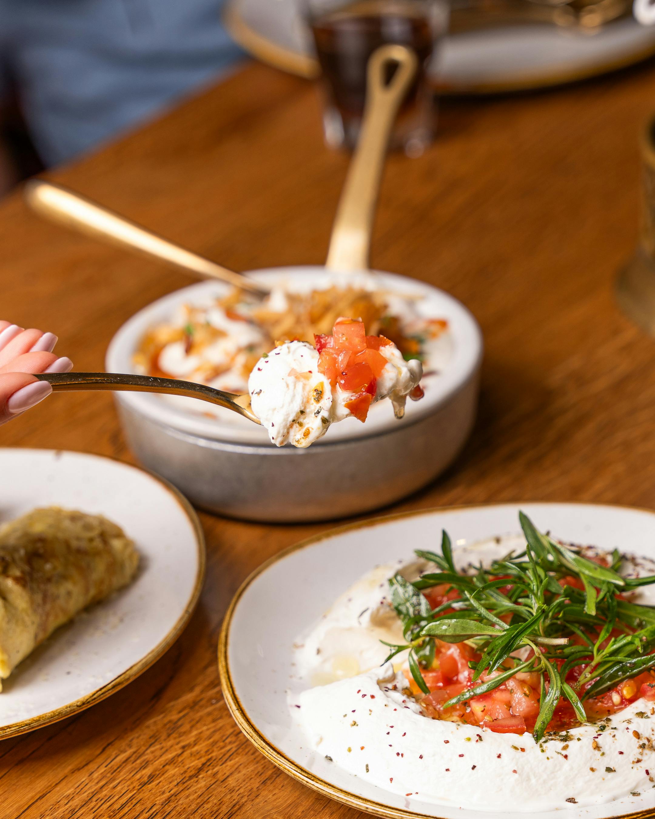 Food on Fork and Plates on Table · Free Stock Photo