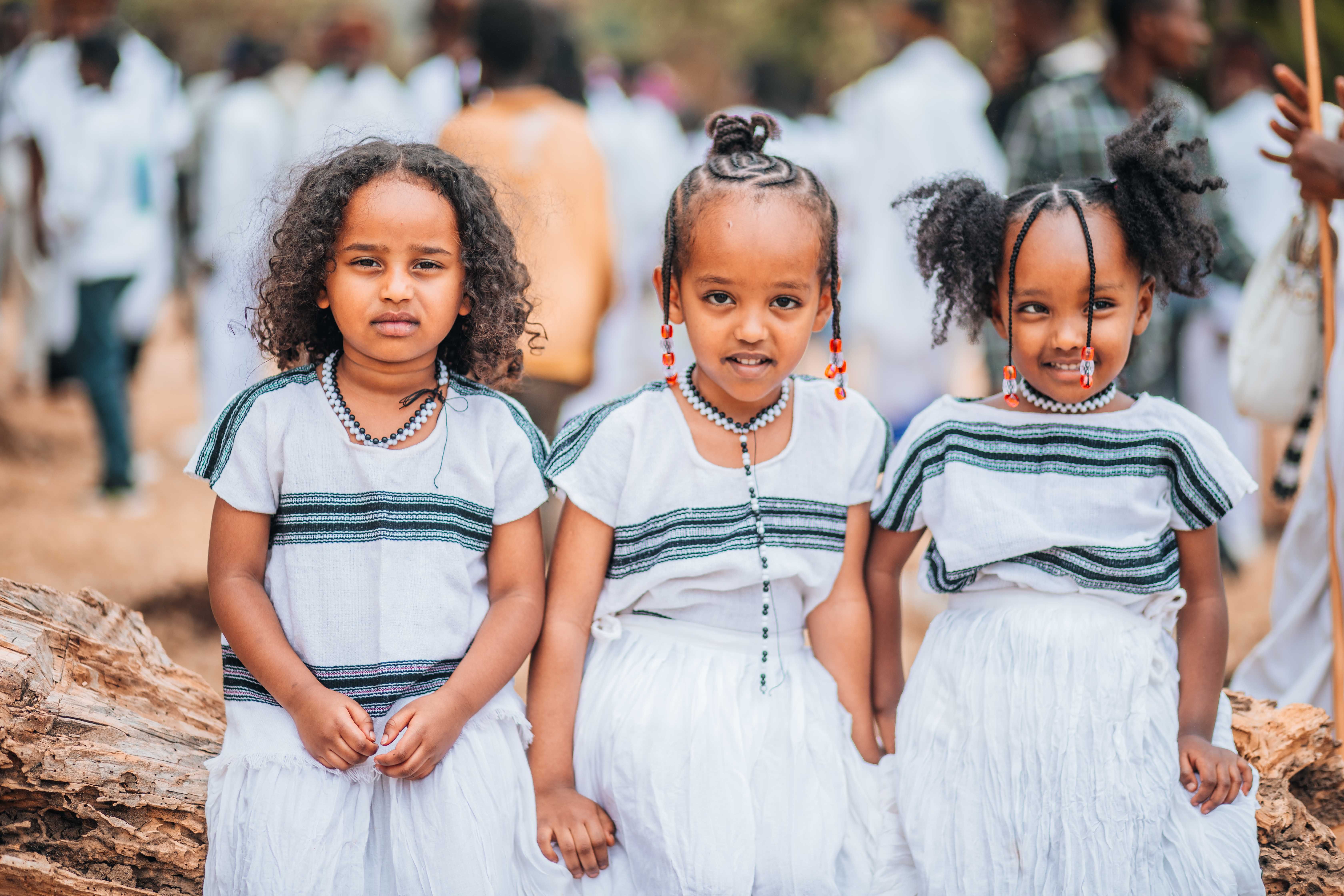 Portrait of Smiling Girls in Traditional Clothing · Free Stock Photo