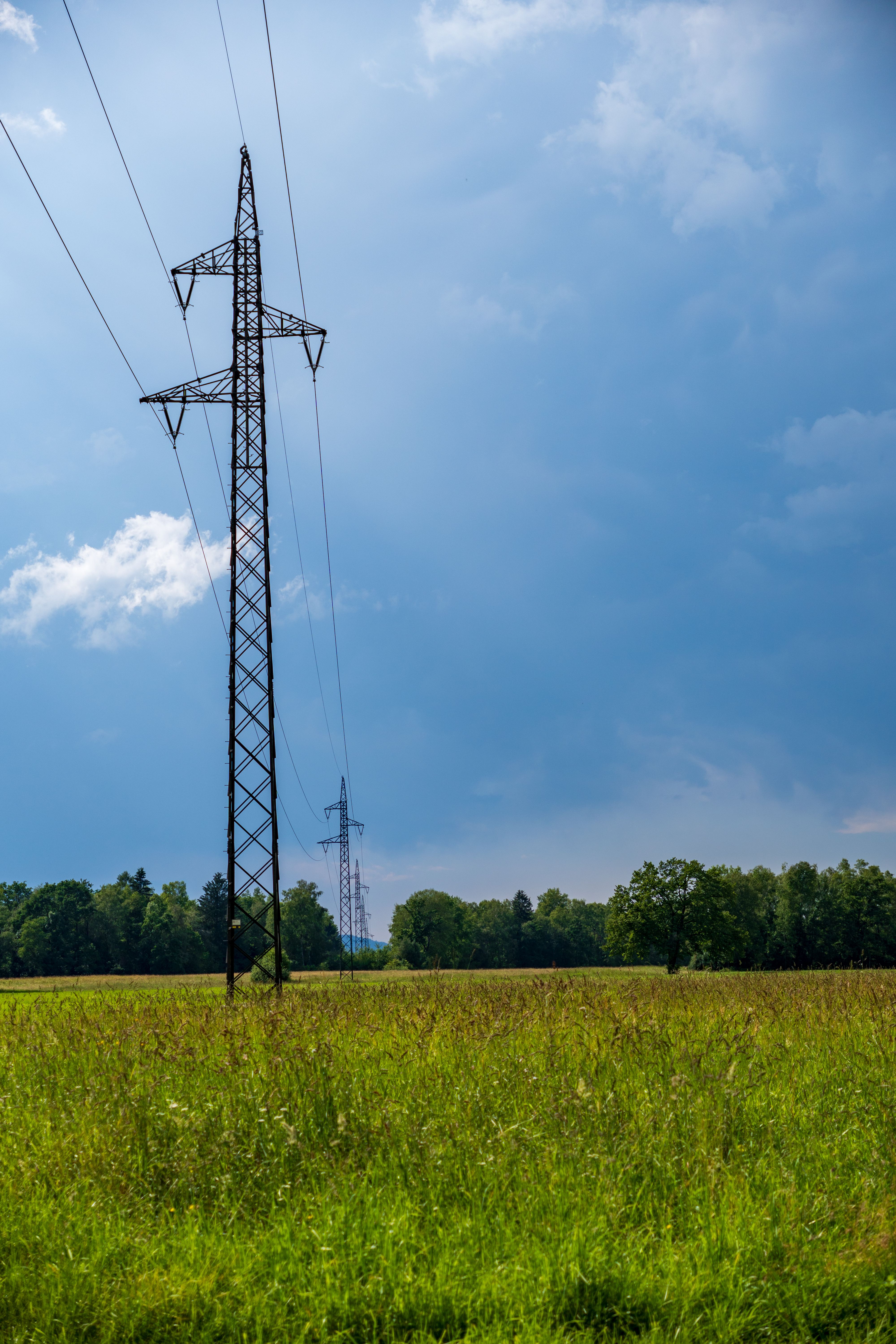 Electricity Pole on a Field · Free Stock Photo