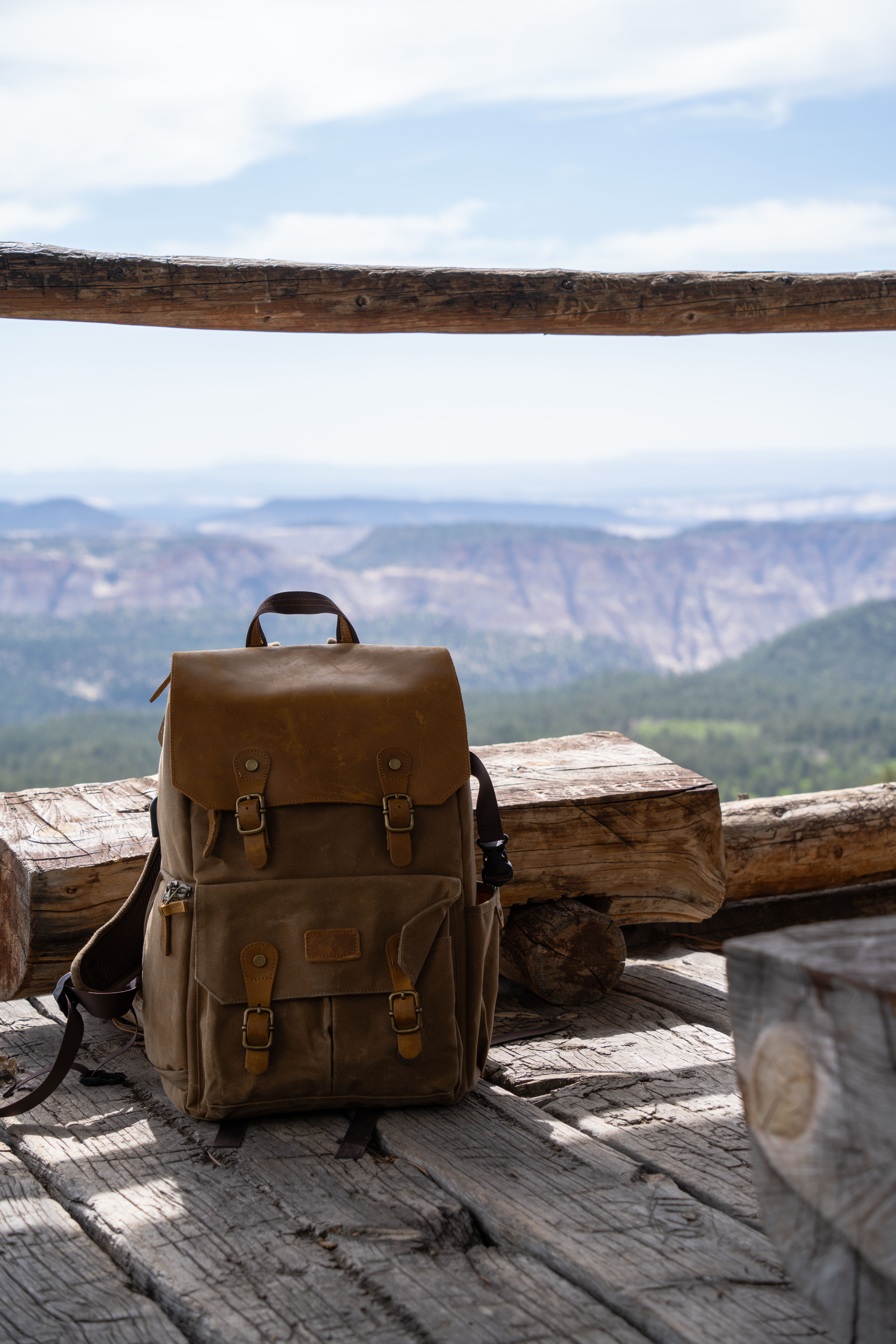Brown Leather Backpack on a Wooden Observation Tower · Free Stock Photo