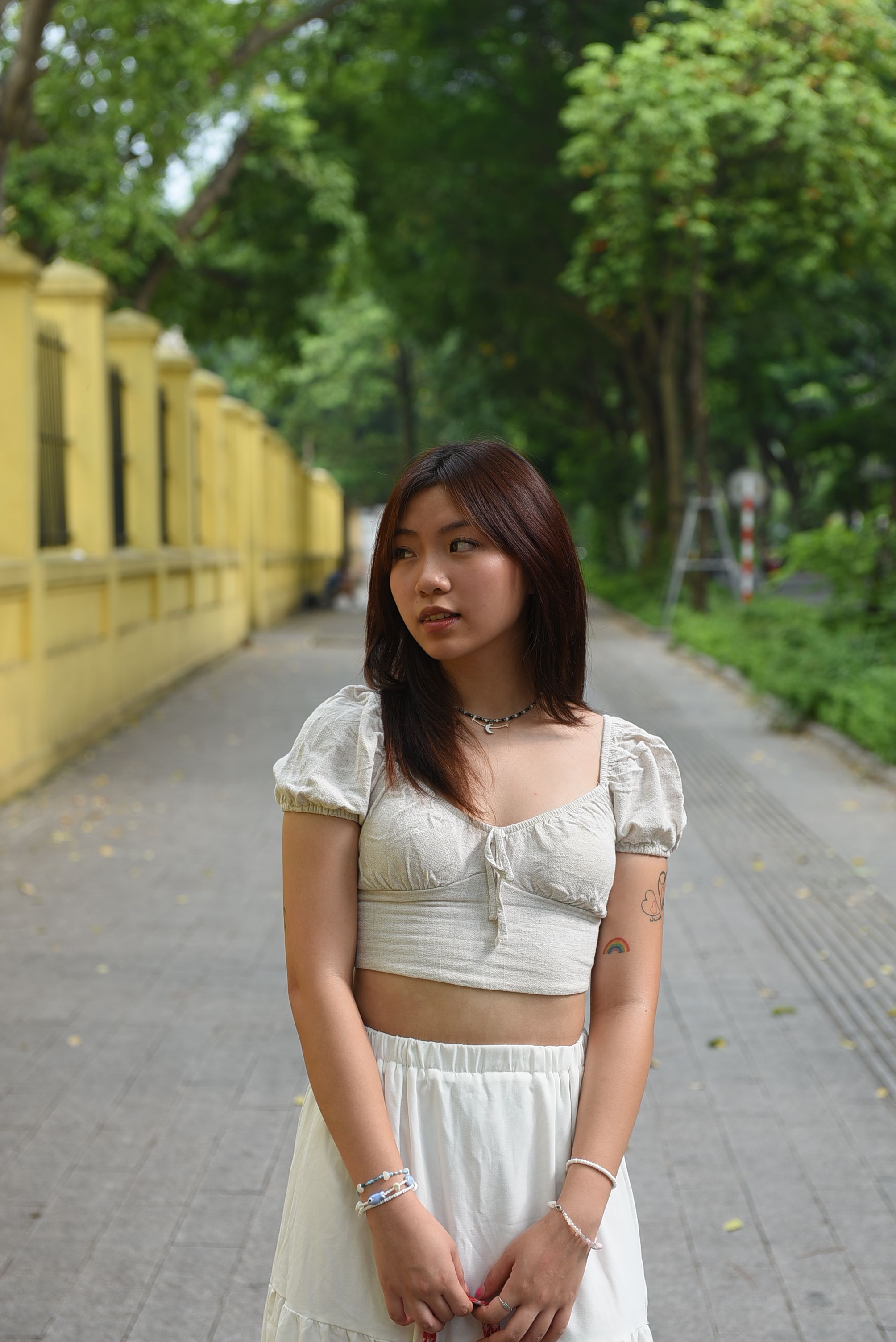 Model in White Crop Top and Skirt Standing on the Sidewalk · Free Stock ...