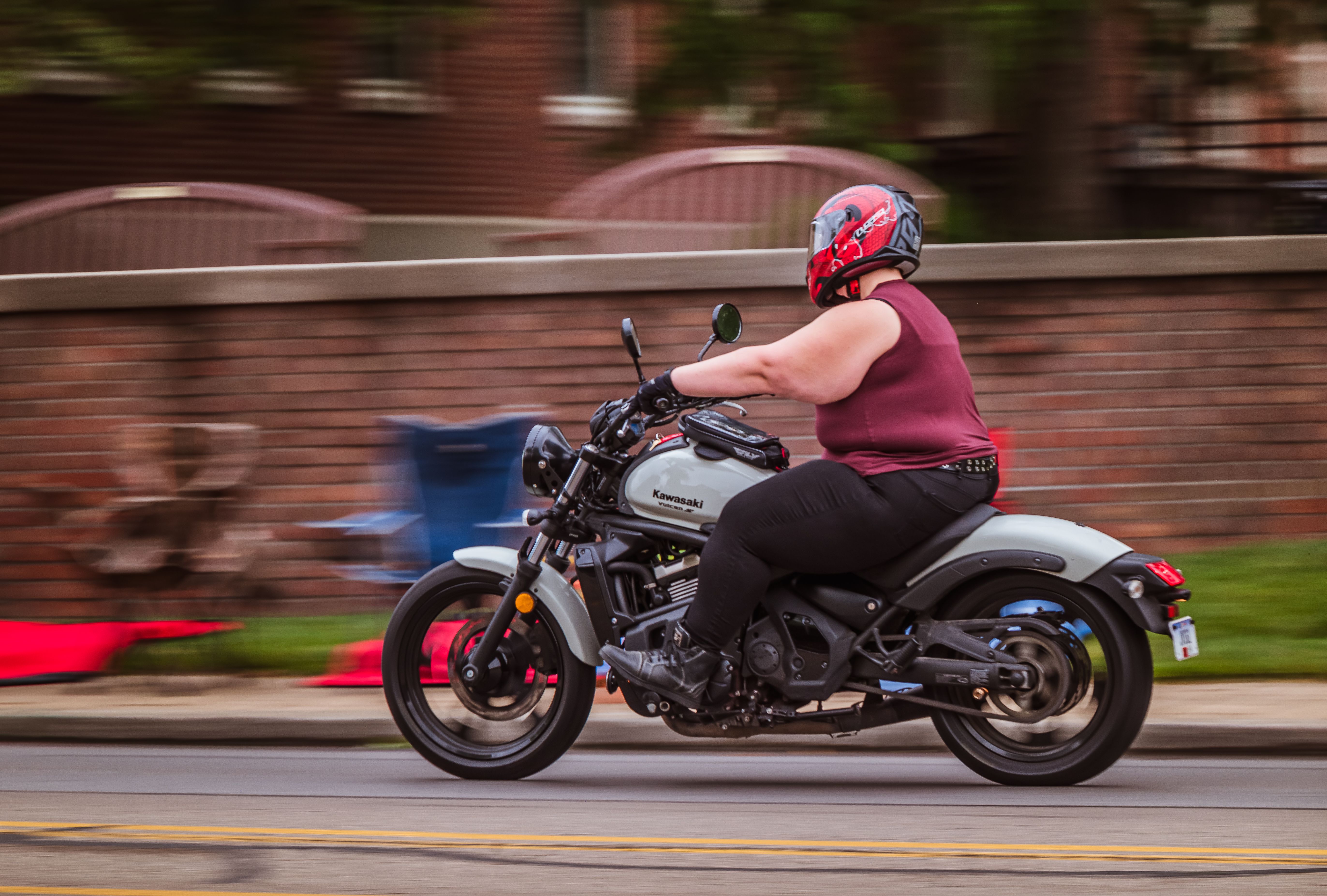 Biker Riding a Kawasaki Vulcan on the Street · Free Stock Photo