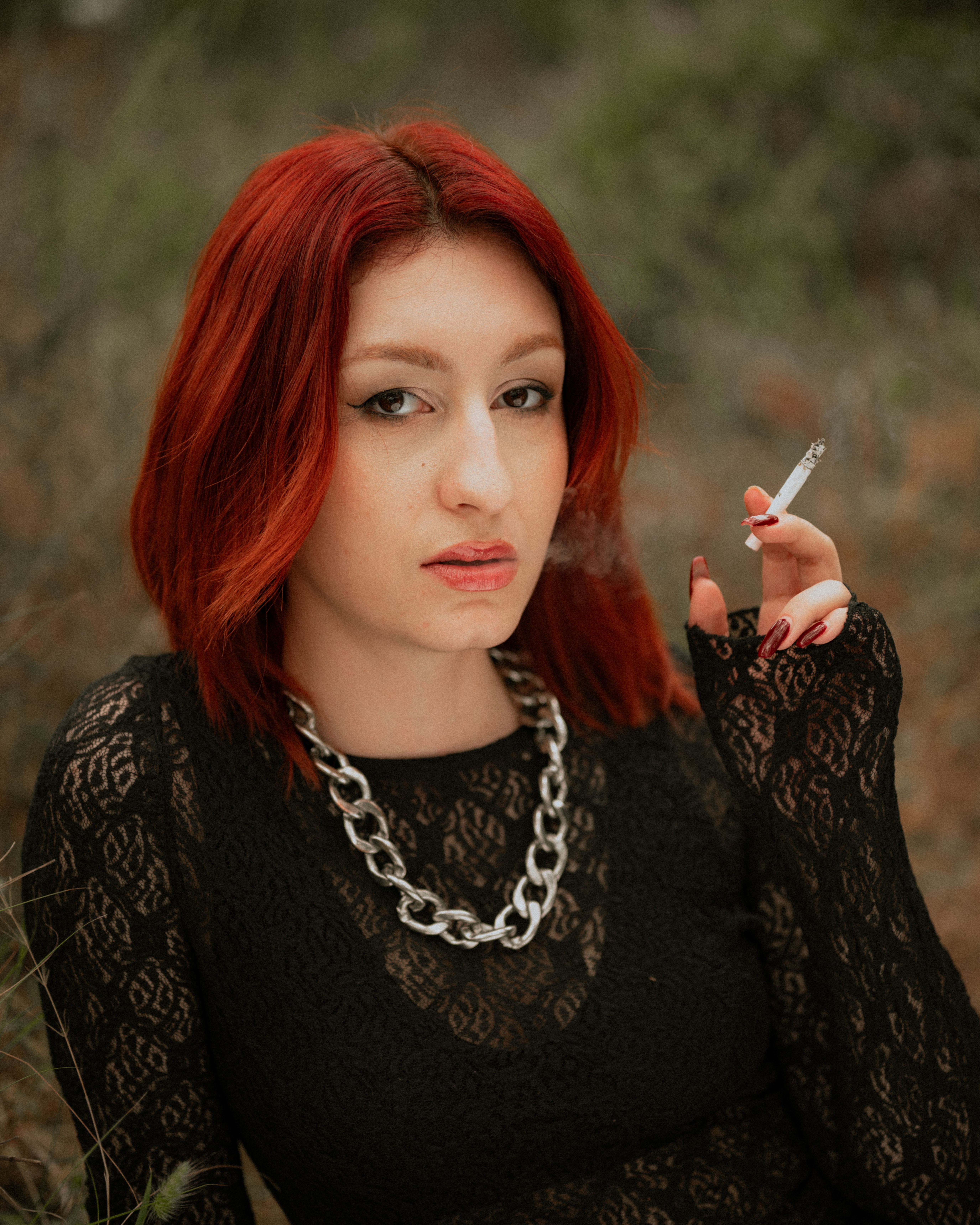 Woman with Red Hair Wearing Black Lace Dress Smoking Cigarette · Free ...