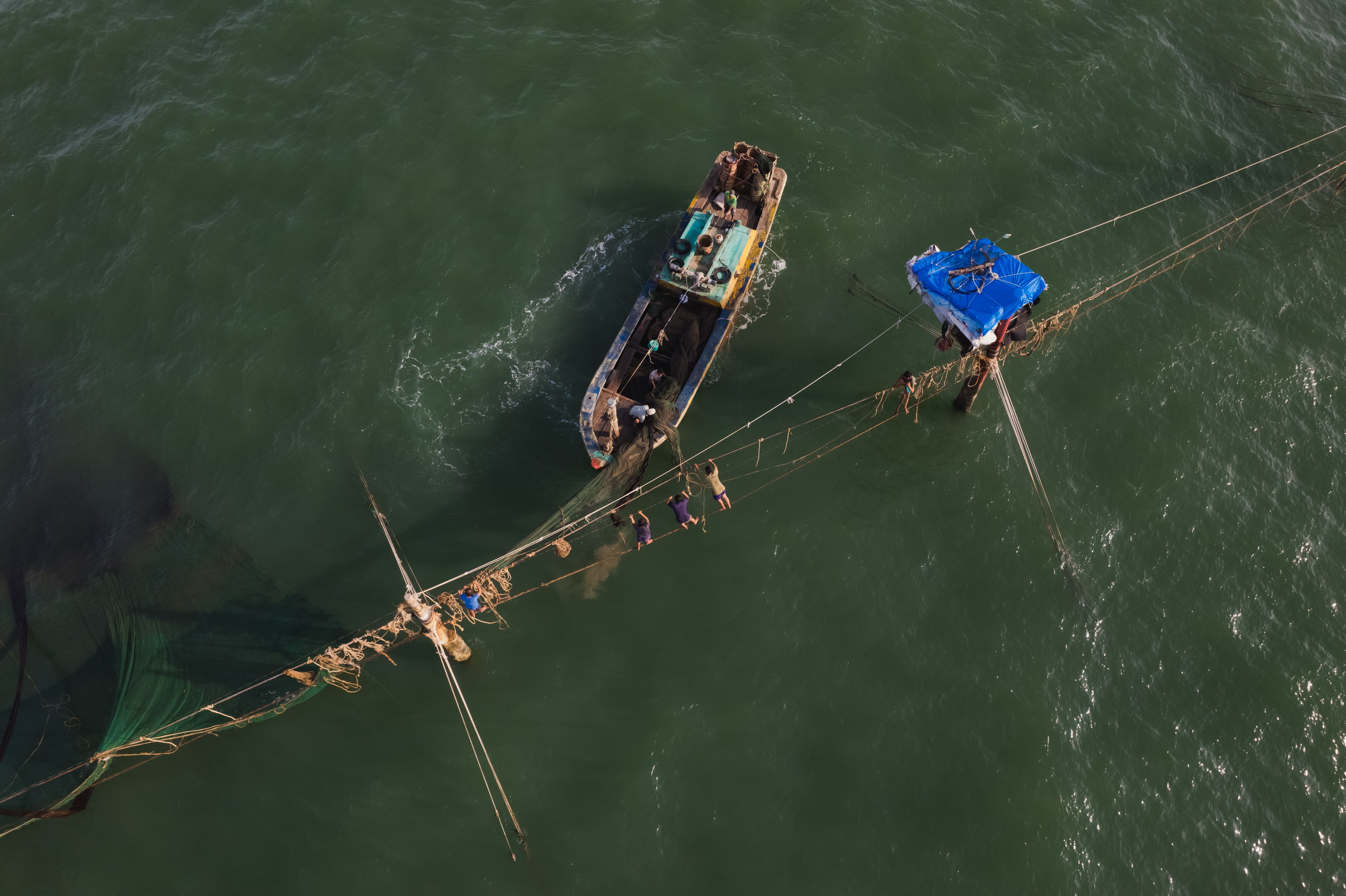 Drone Shot of Fishing Boat on River · Free Stock Photo