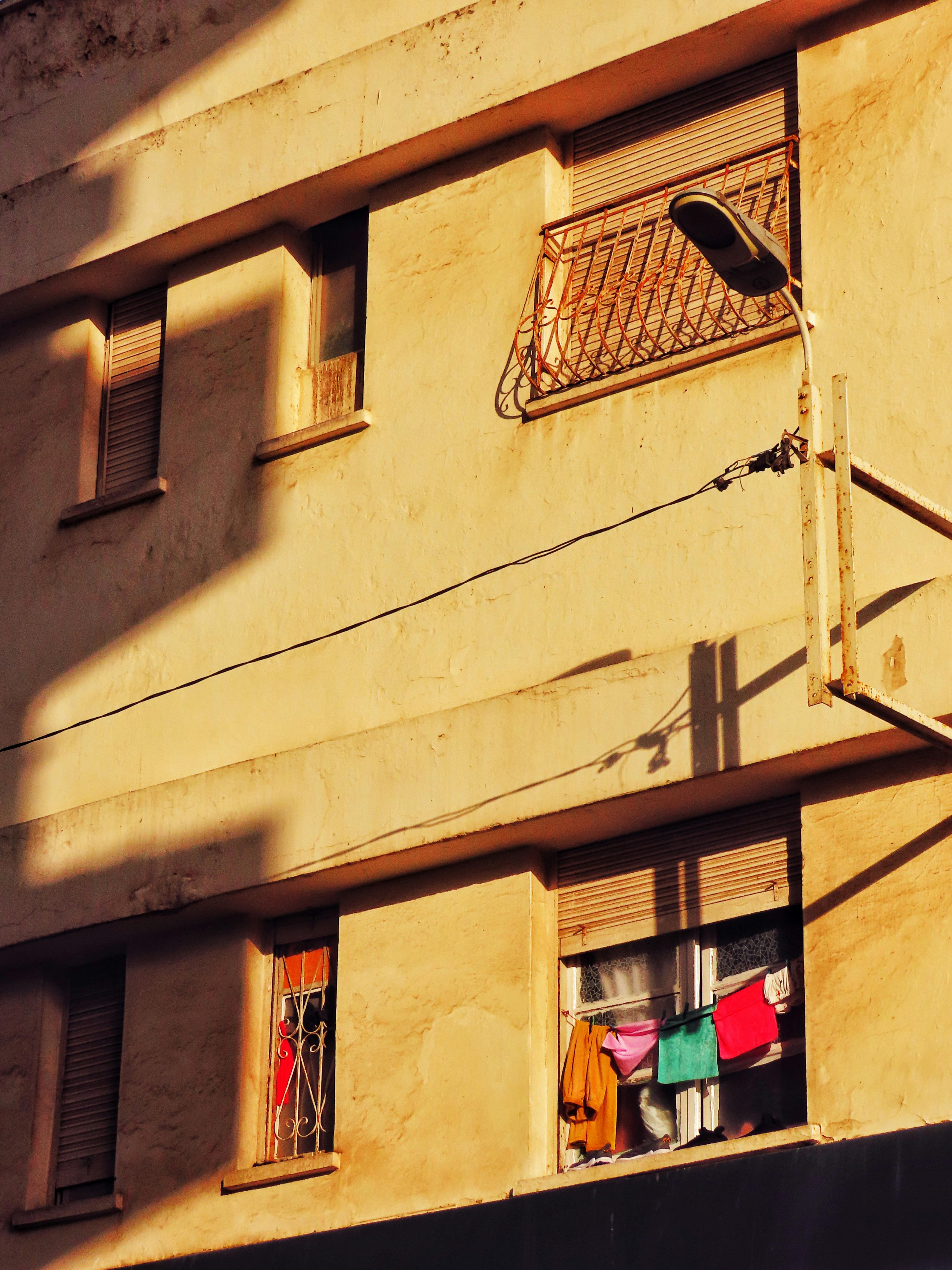 Sunlit Wall of Building with Apartments · Free Stock Photo