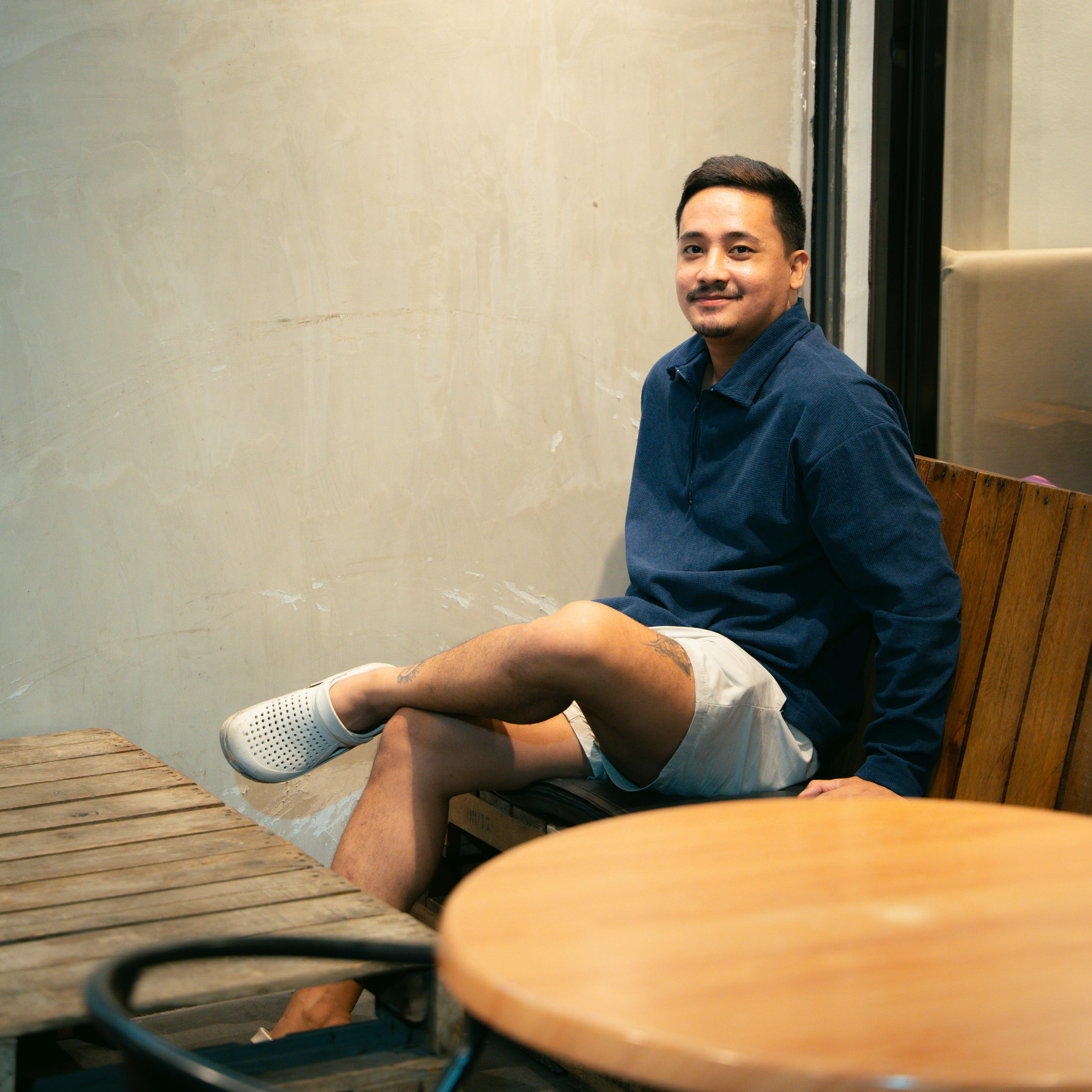 A Man with Mustache Sitting on a Bench · Free Stock Photo