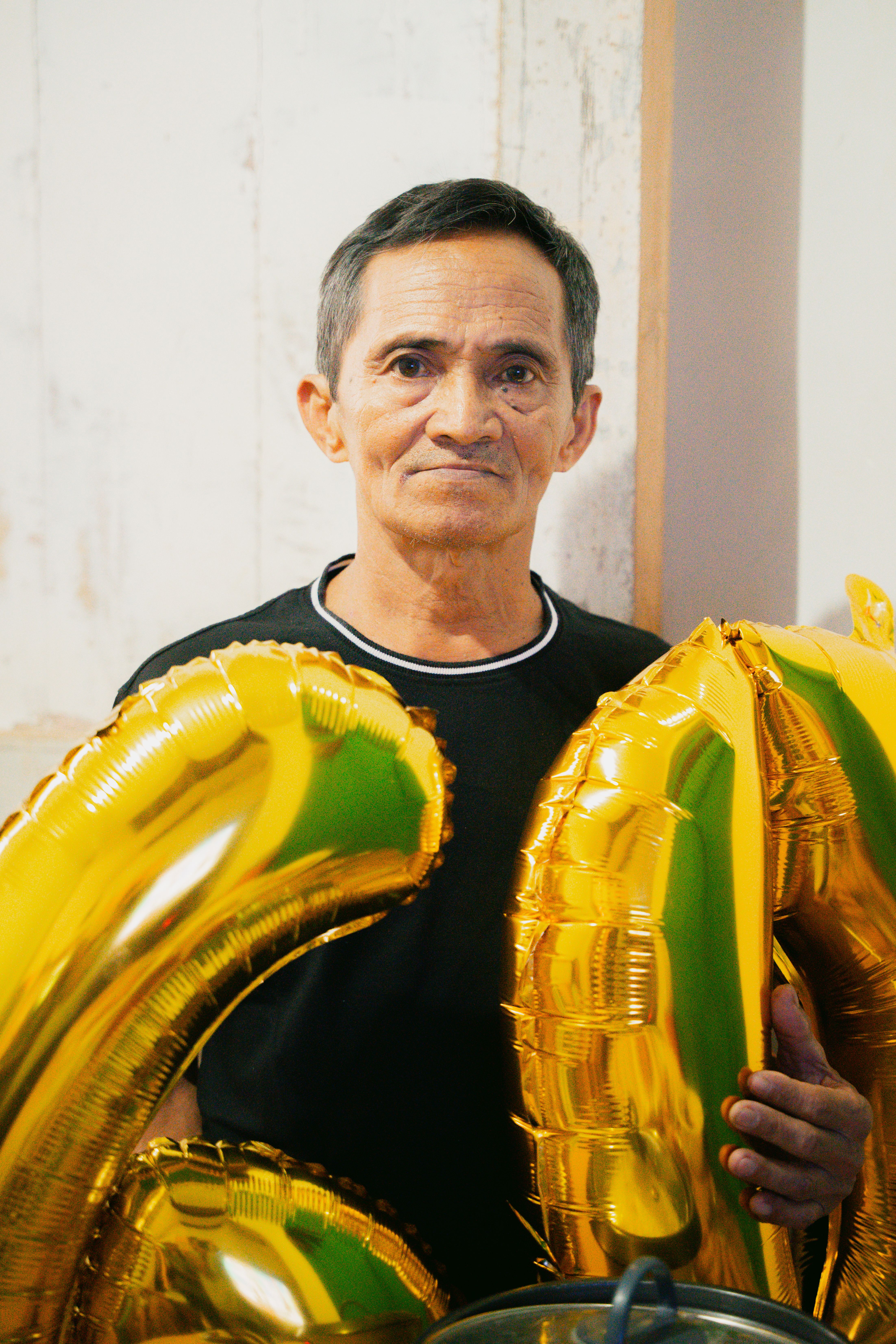 Portrait of Man Holding Birthday Balloons · Free Stock Photo