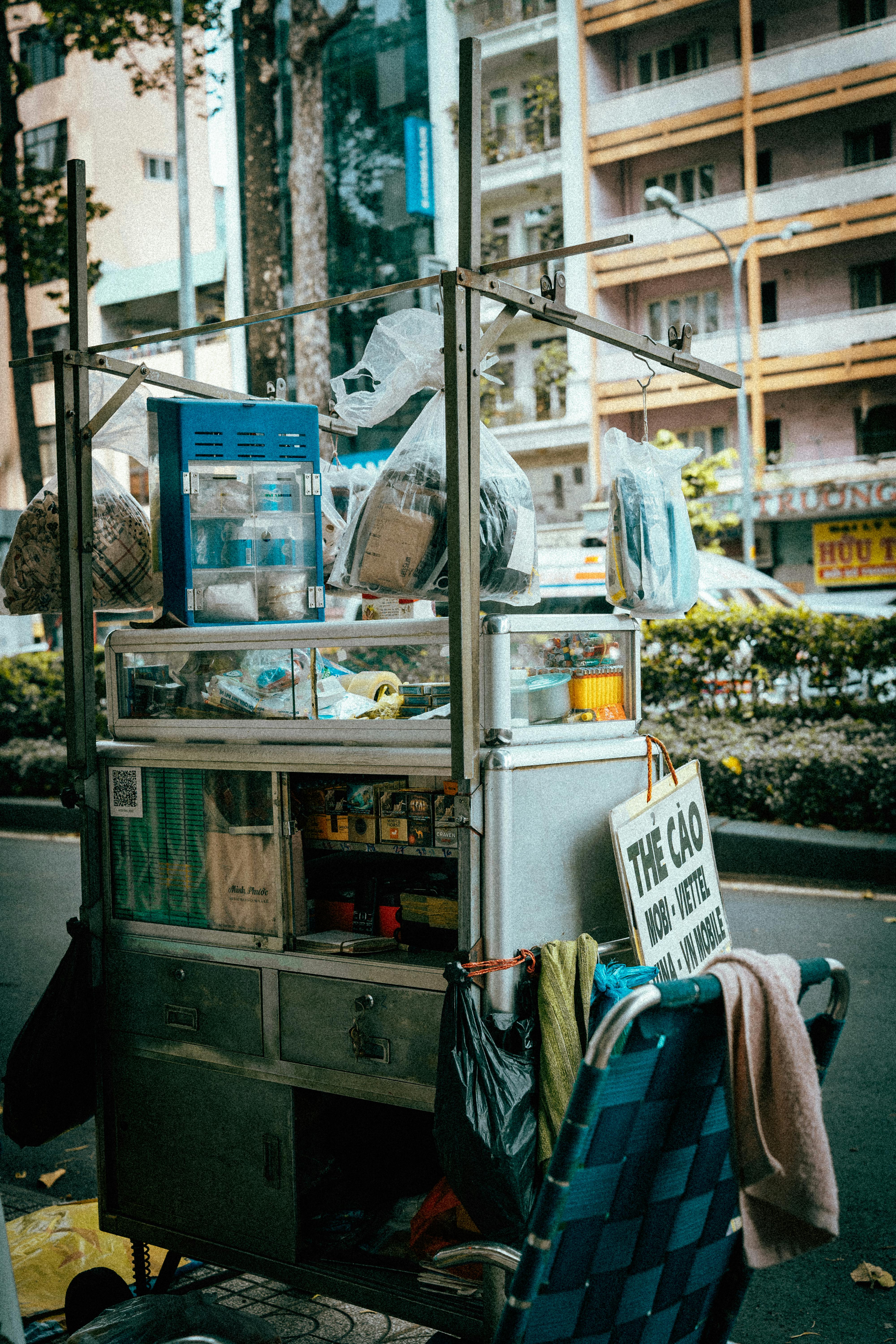 A Booth Standing in the Sidewalk in a City · Free Stock Photo