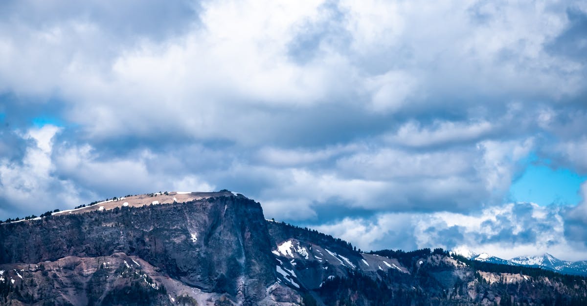Scenic View Of Cliff Under Cloudy Sky · Free Stock Photo Scenic View Of Cliff Under Cloudy Sky · Free Stock Photo