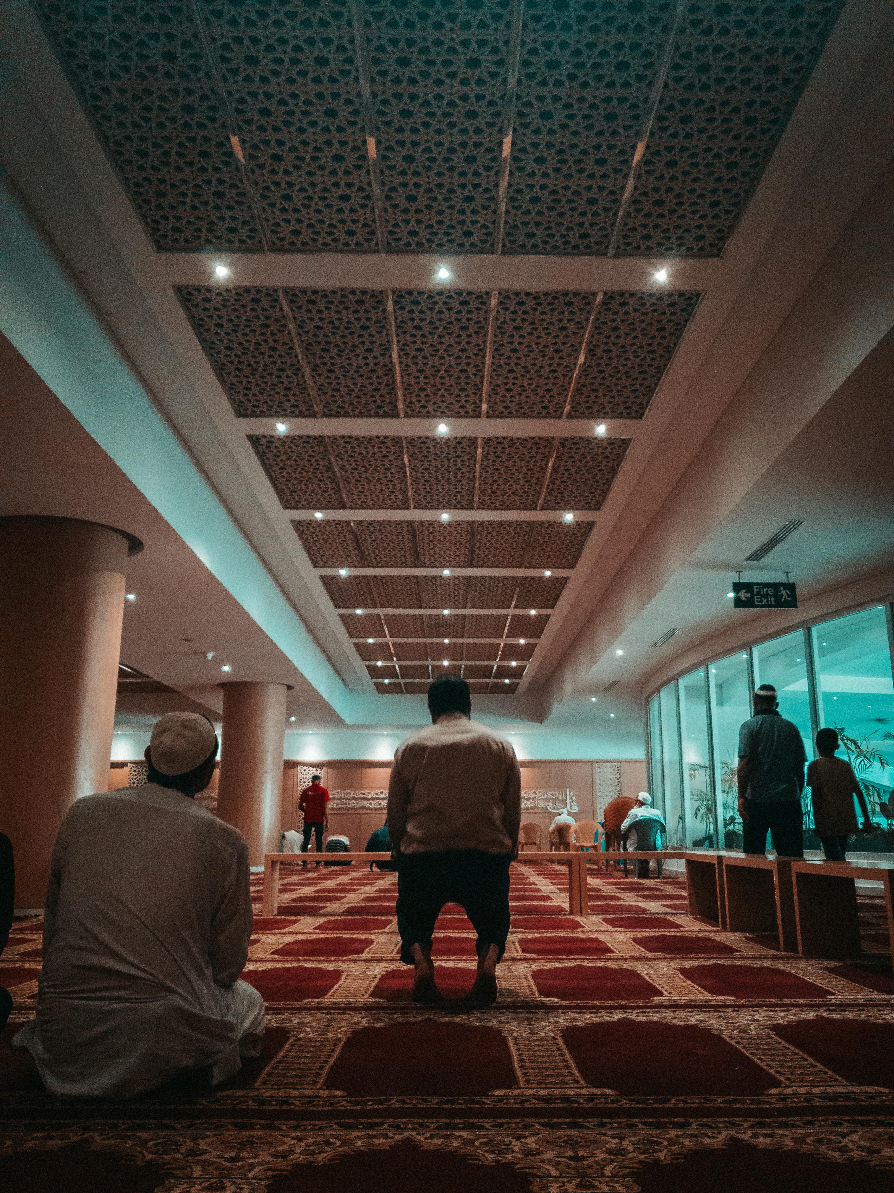 Man Sitting on Floor Inside Room · Free Stock Photo
