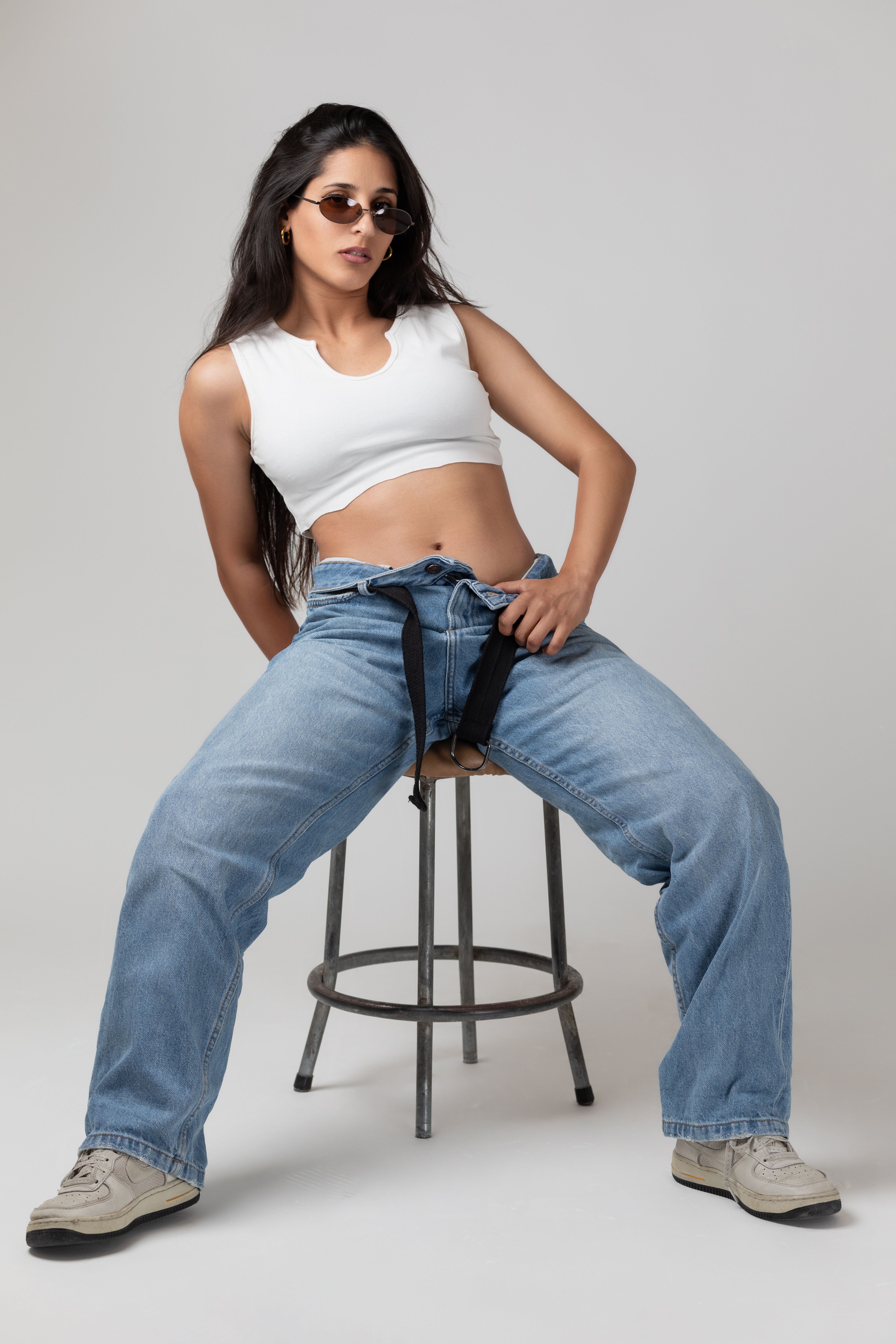 Model Posing in Jeans and a Crop Top · Free Stock Photo