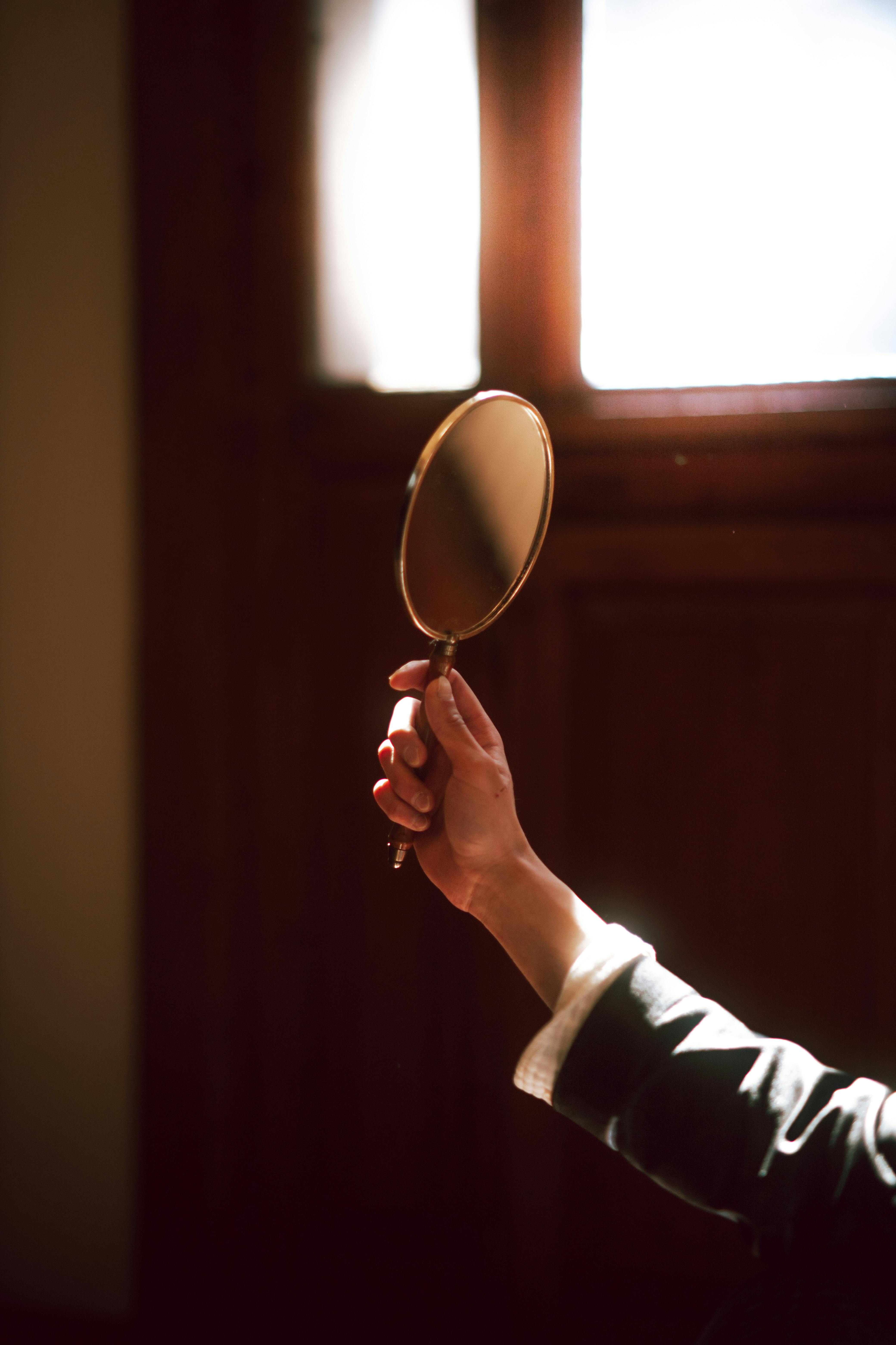 Person Hand Holding Mirror · Free Stock Photo