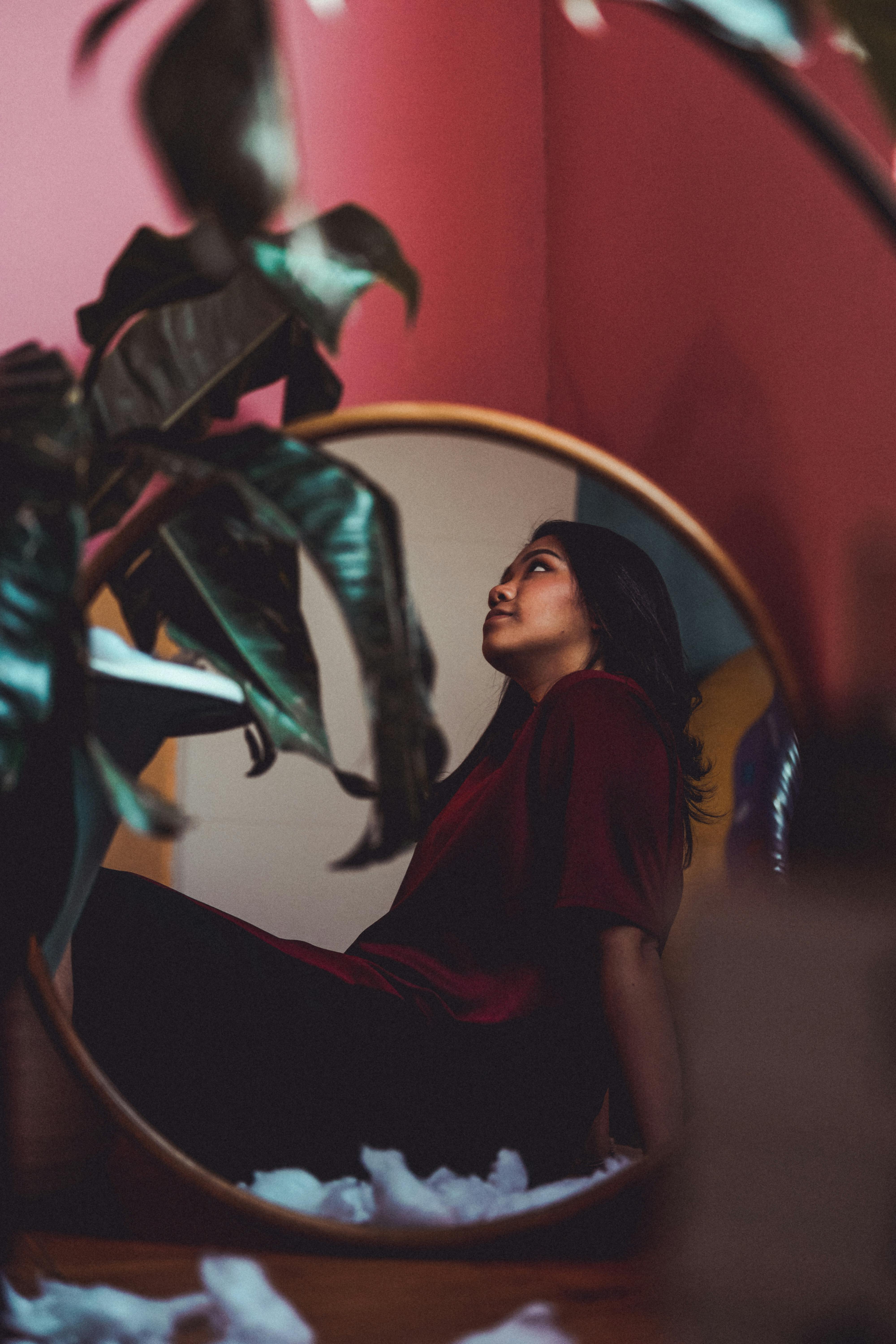 Woman in Red Dress Sitting on a Log · Free Stock Photo