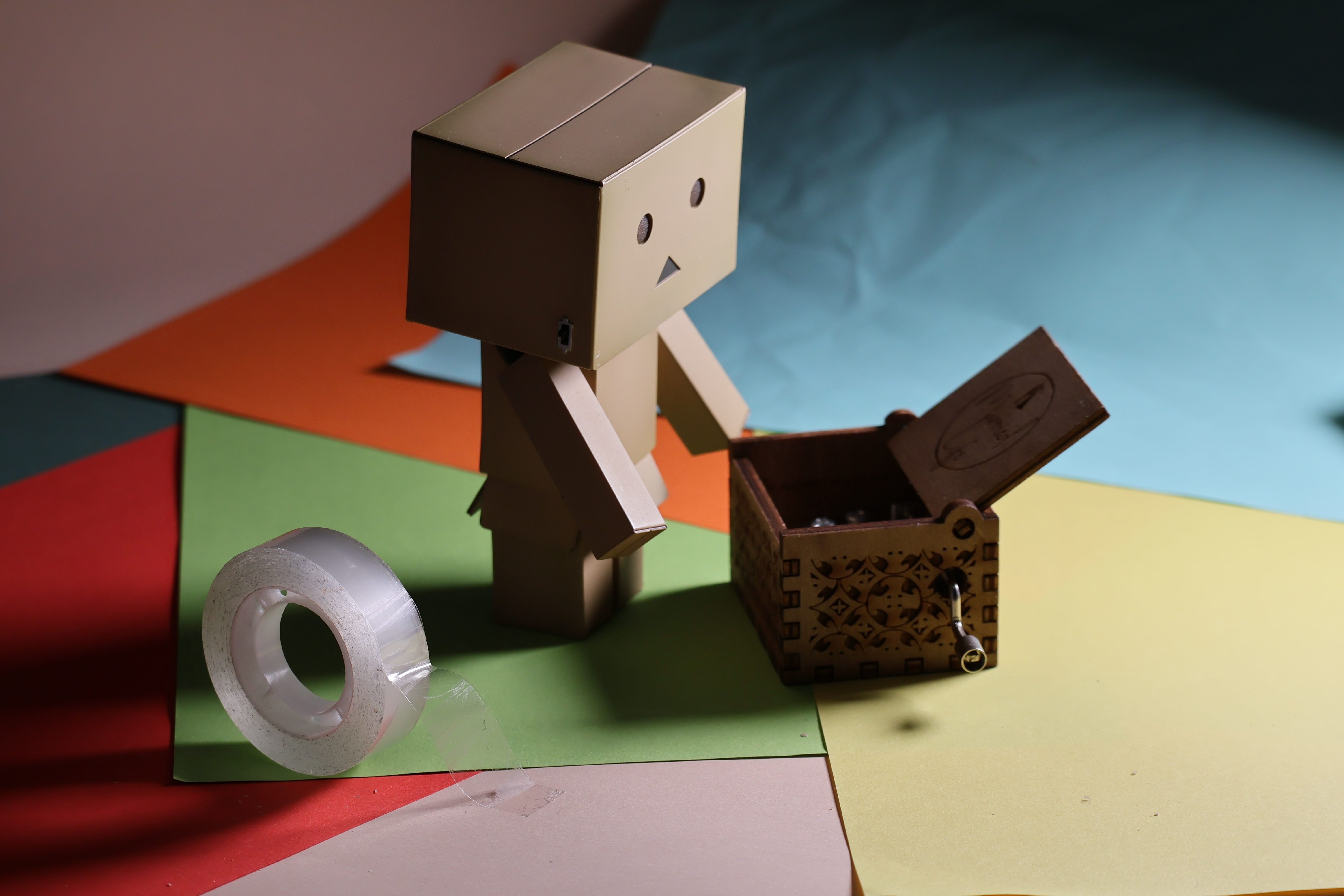 Close-up of a Small Cardboard Figurine · Free Stock Photo
