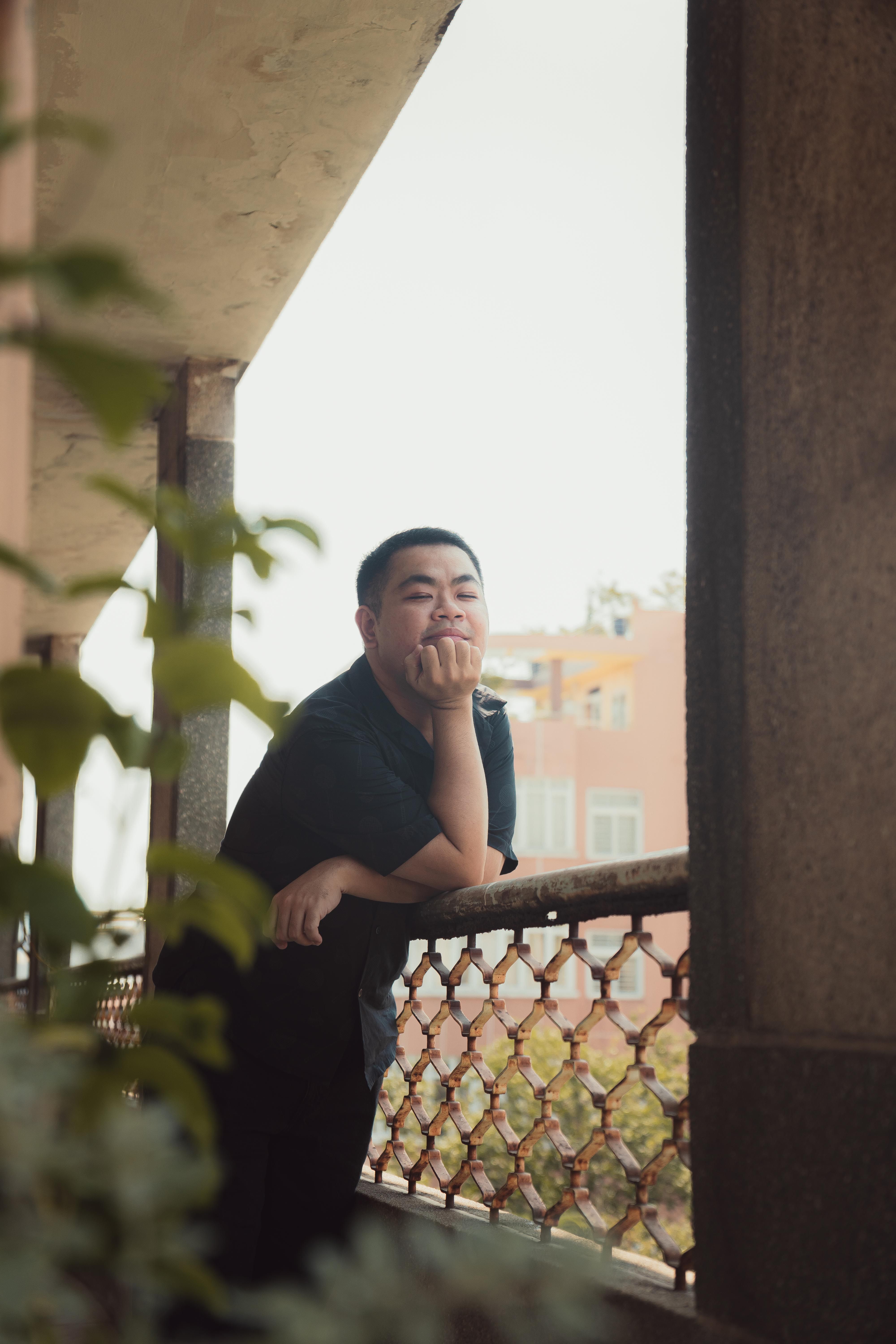 Man Standing on Balcony · Free Stock Photo