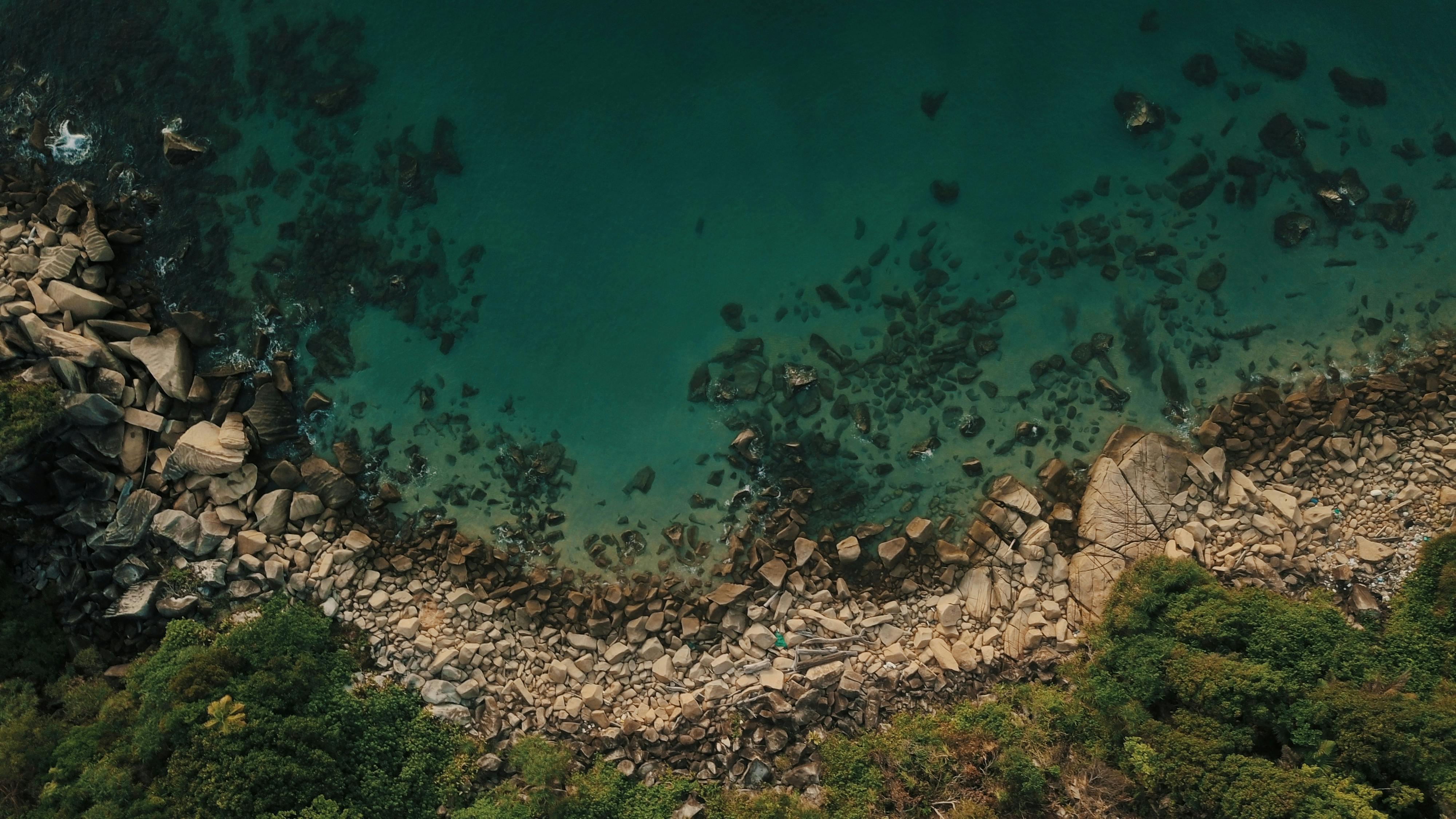 Top View Photo of Rocky Shore · Free Stock Photo