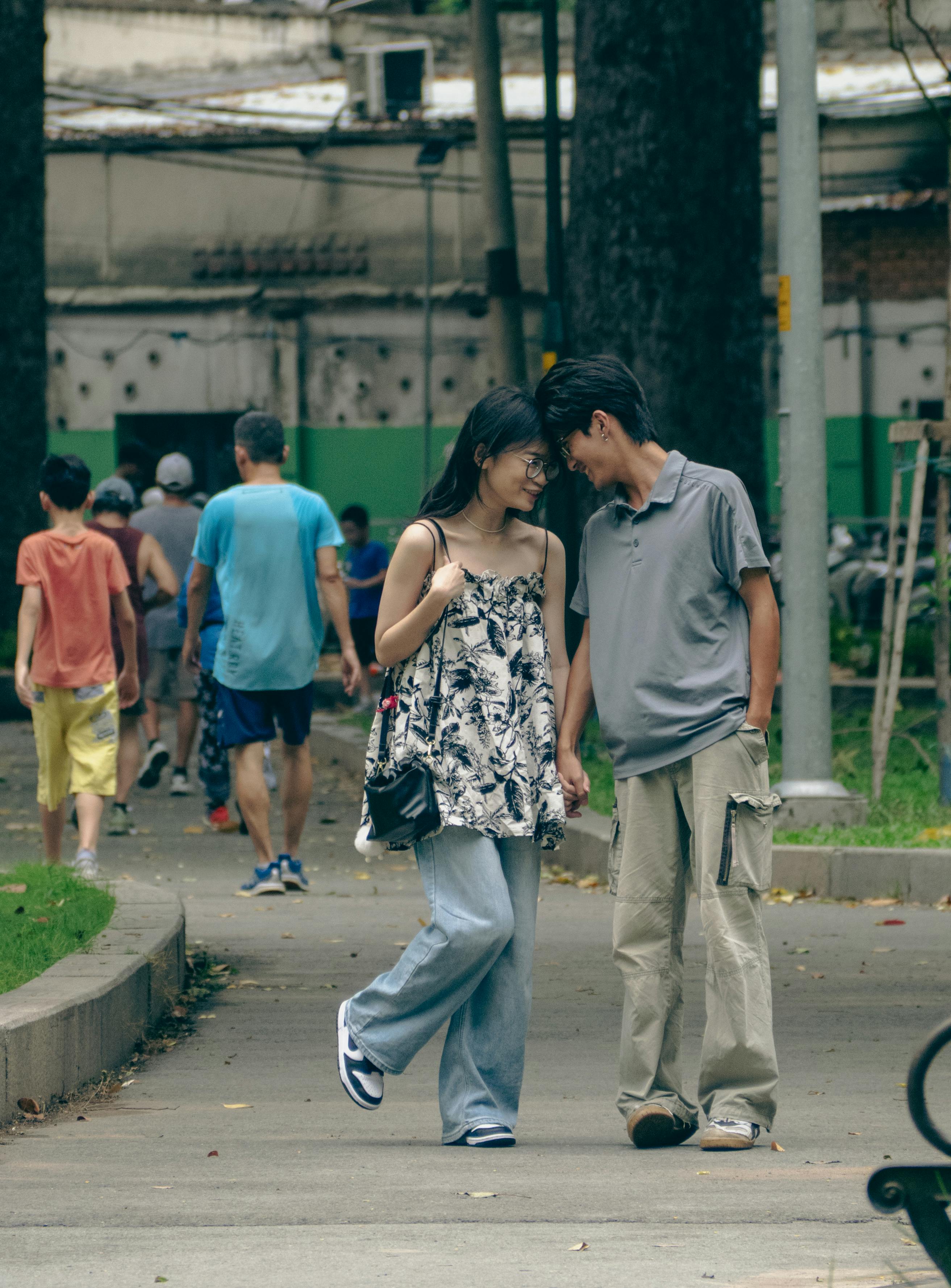 Lovely Couple Holding Hands and Touching Each Others Head · Free Stock Photo
