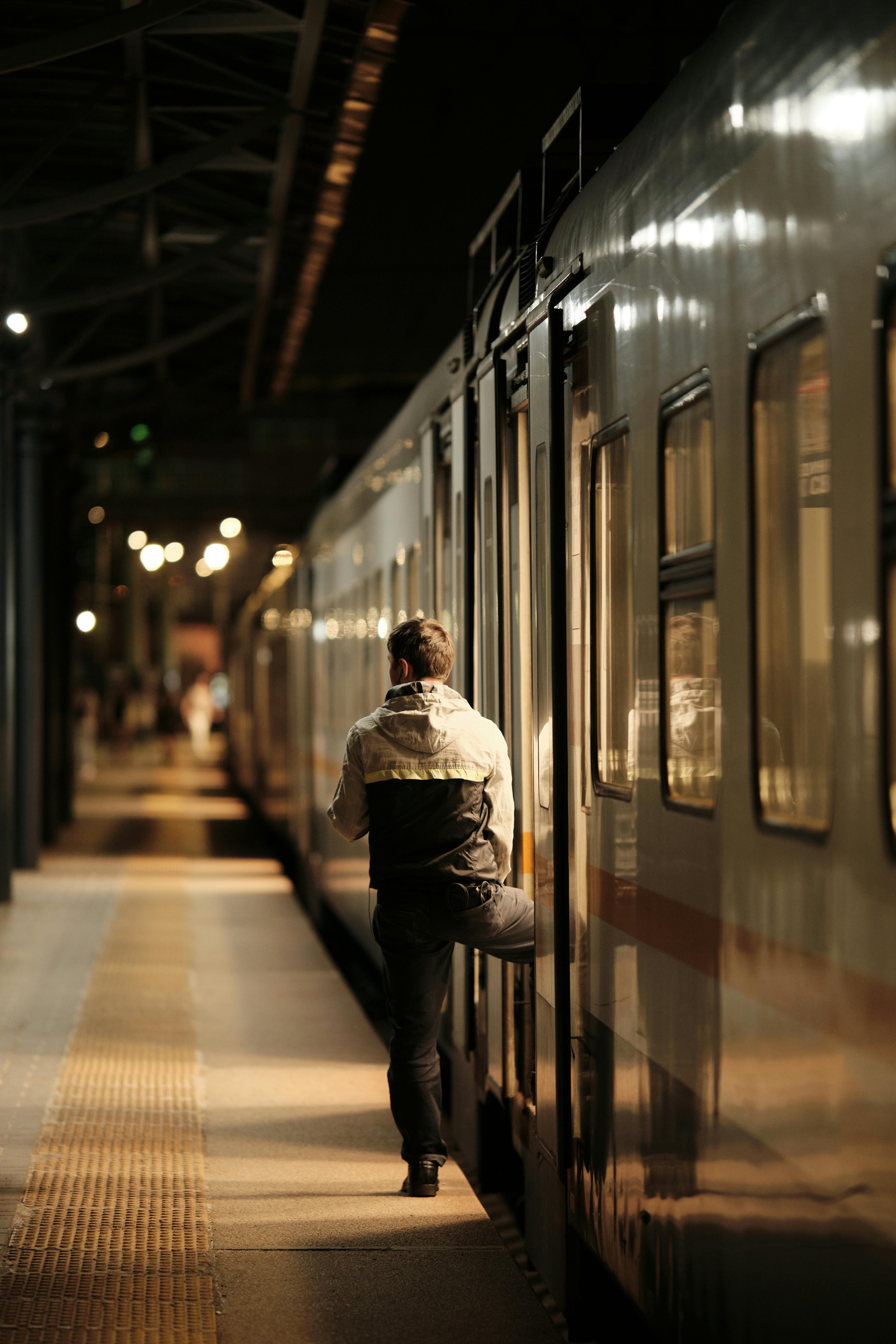 Passenger Getting Off a Train Car · Free Stock Photo