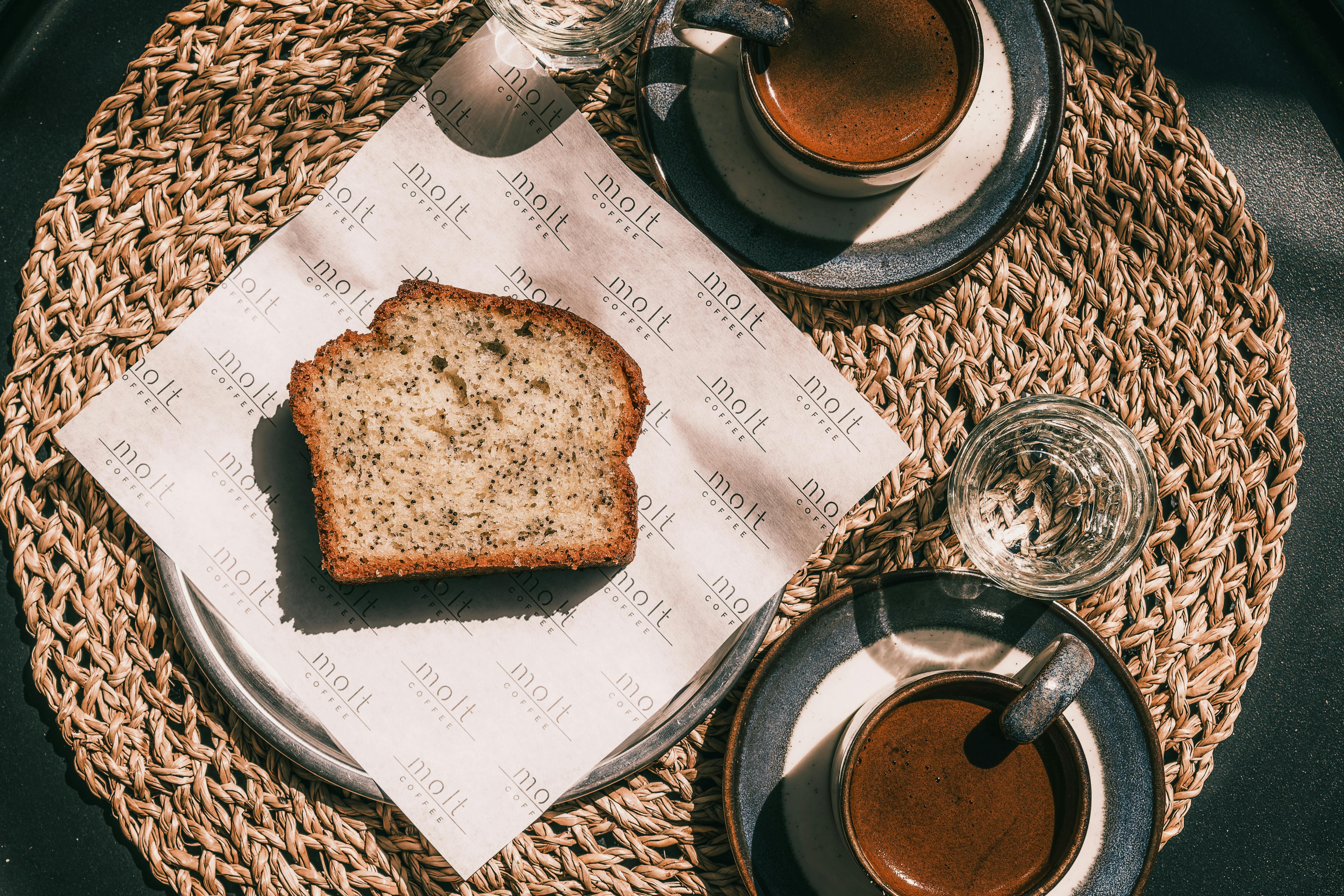 Two Cups of Black Coffee and a Slice of Cake Lying on a Table · Free ...