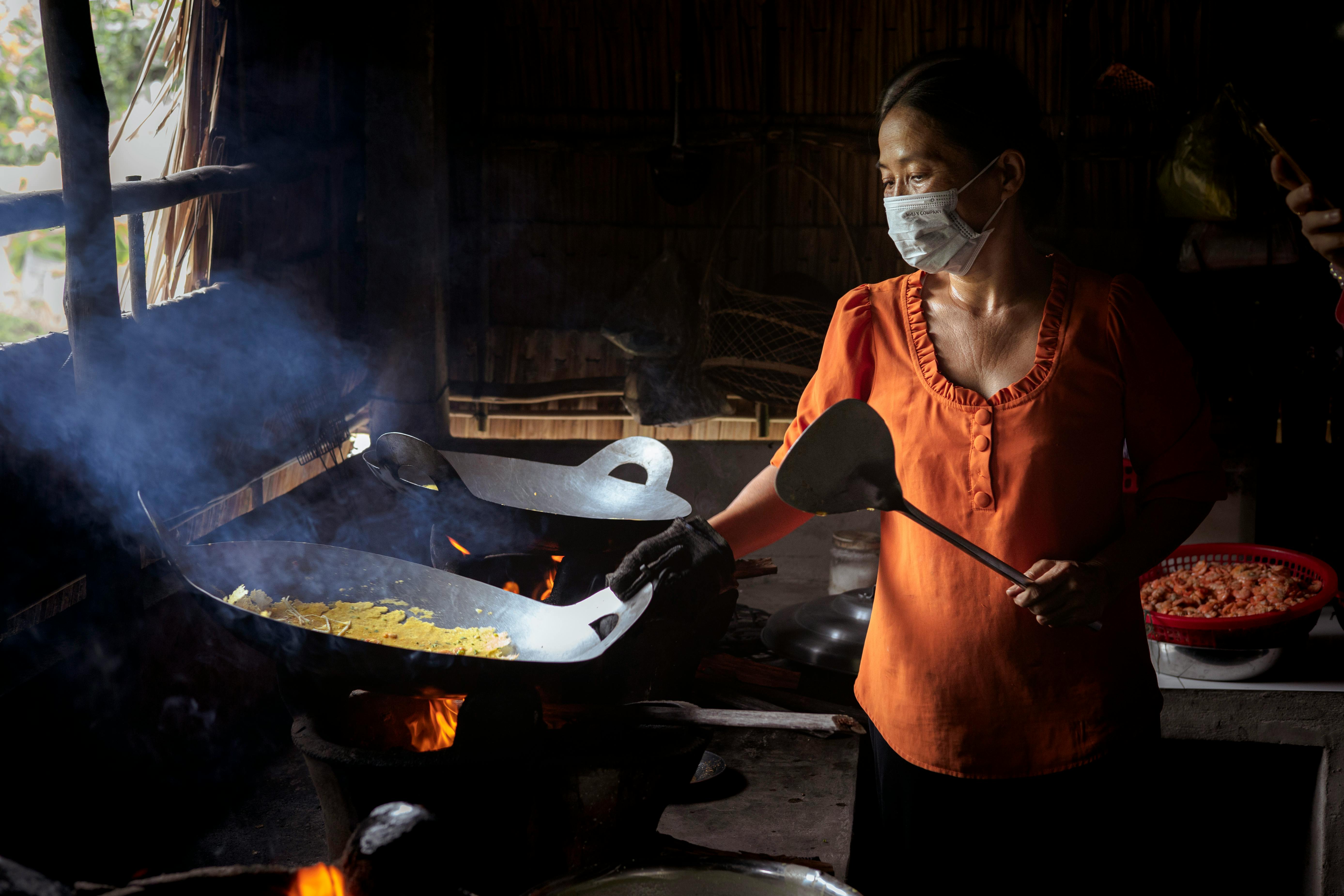 Woman in Face Mask Preparing Traditional · Free Stock Photo