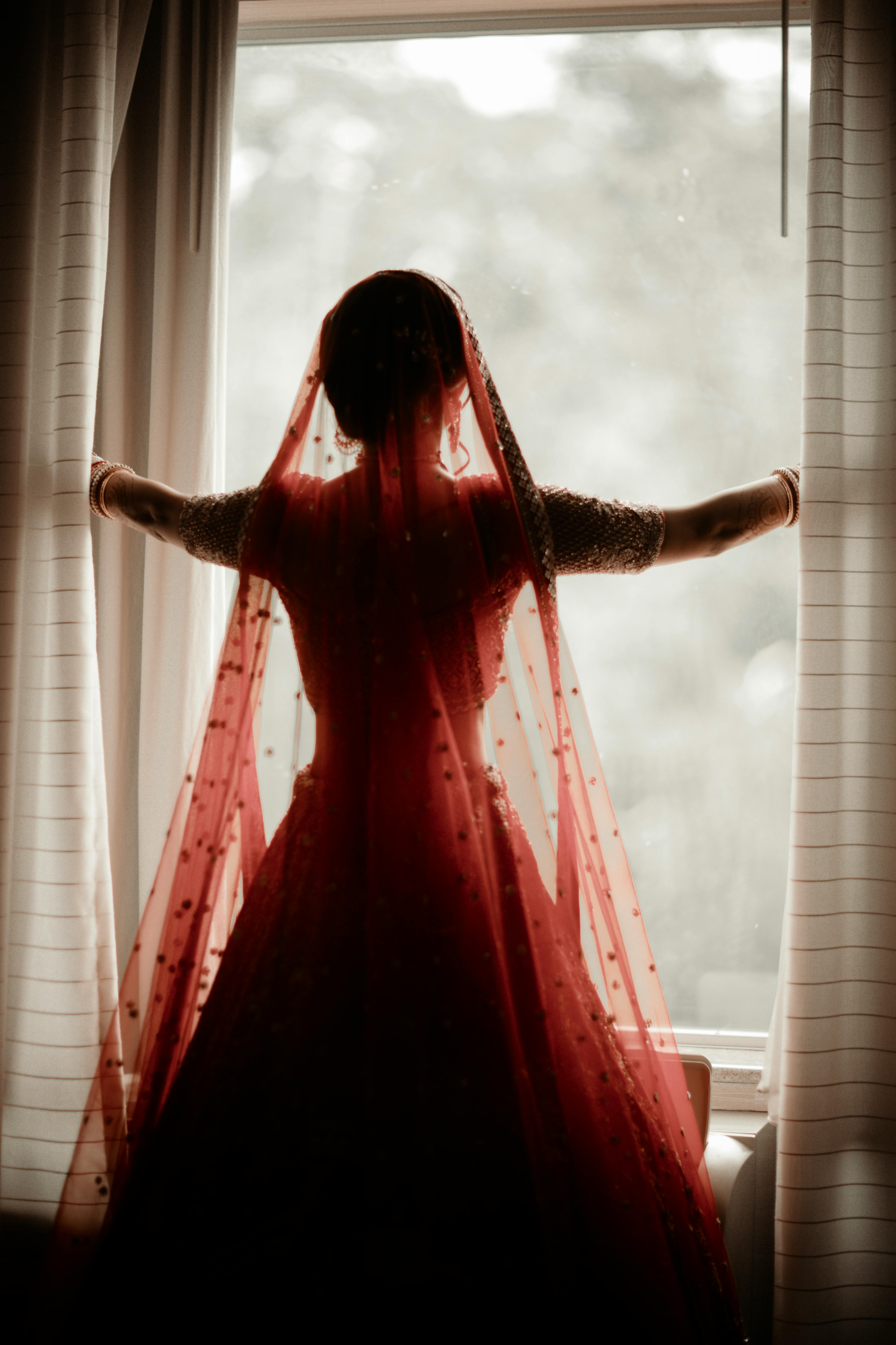 Back View of Skinny Woman in Red Veil Looking out of Window · Free ...