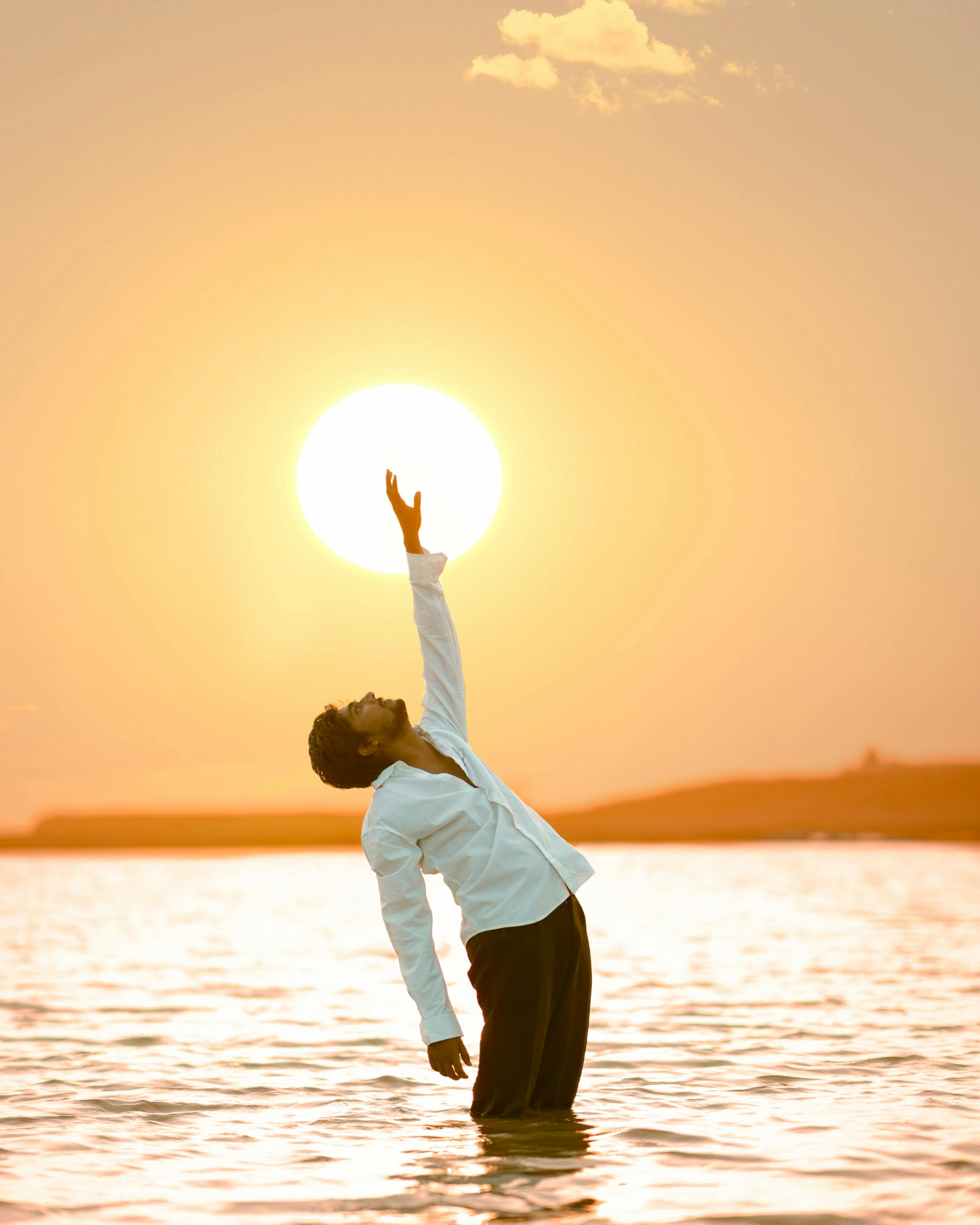 Man Touching Sun · Free Stock Photo
