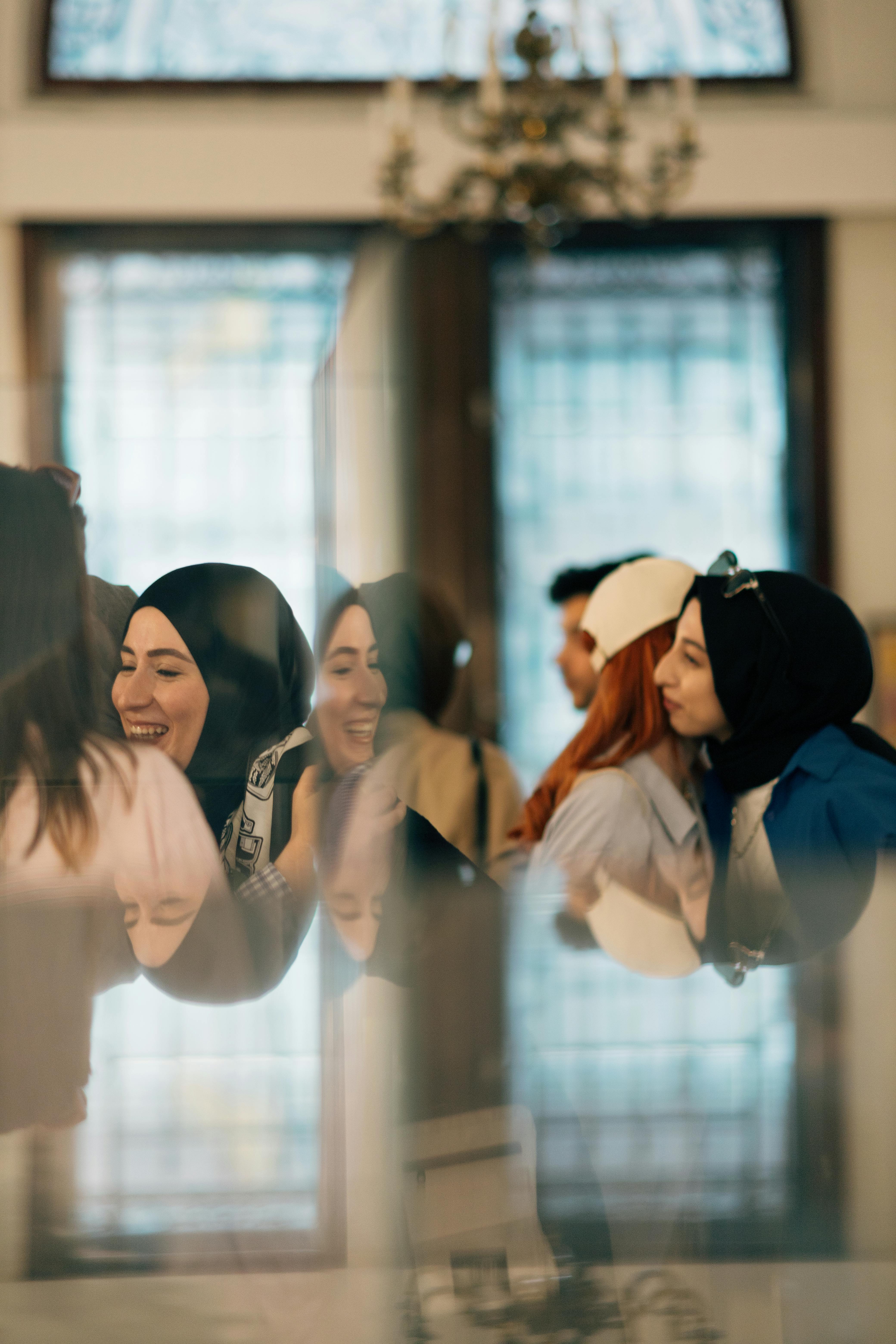 Smiling Women behind Window · Free Stock Photo