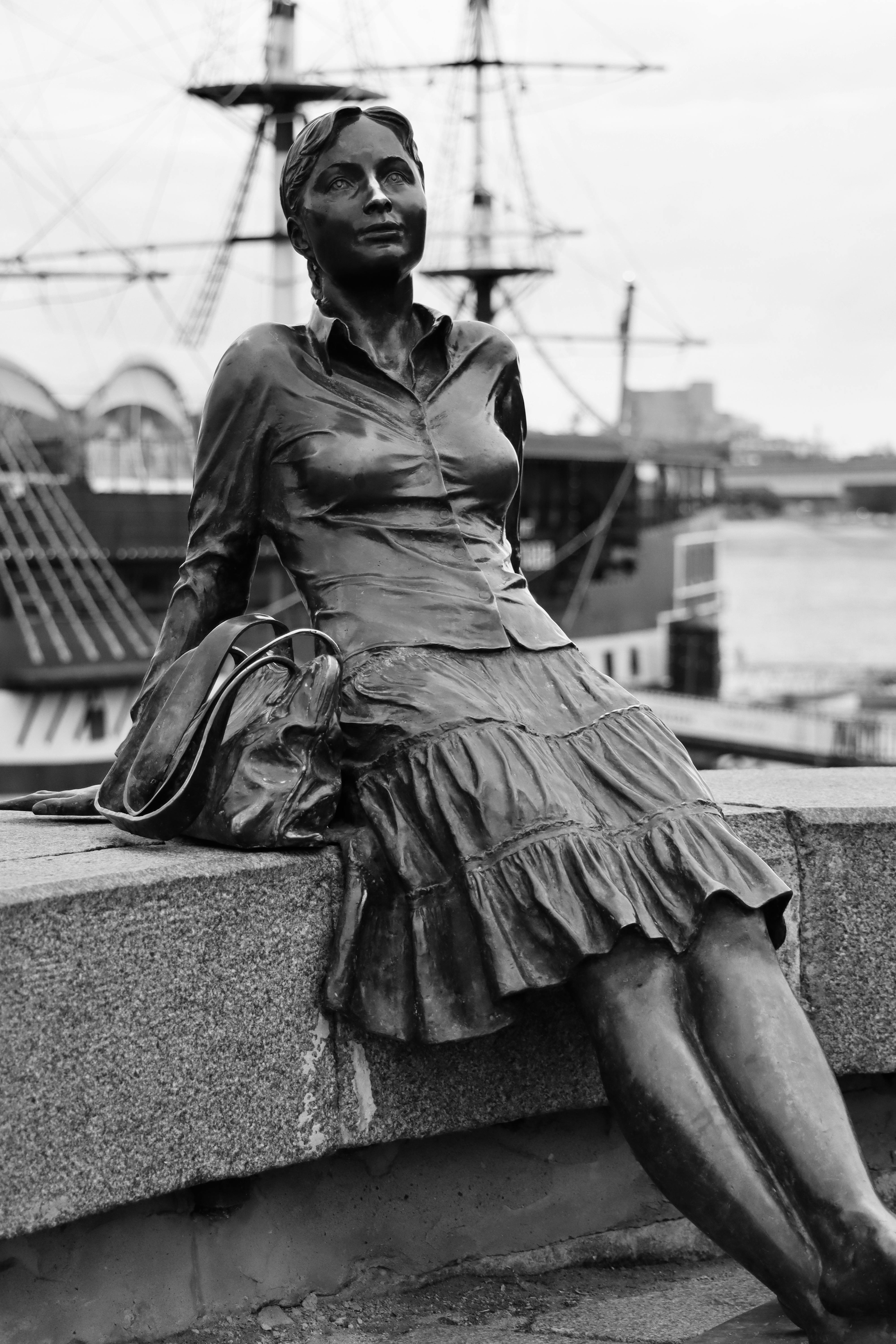 Bronze Sculpture on the Riverside Promenade with a Sailing Ship in the ...