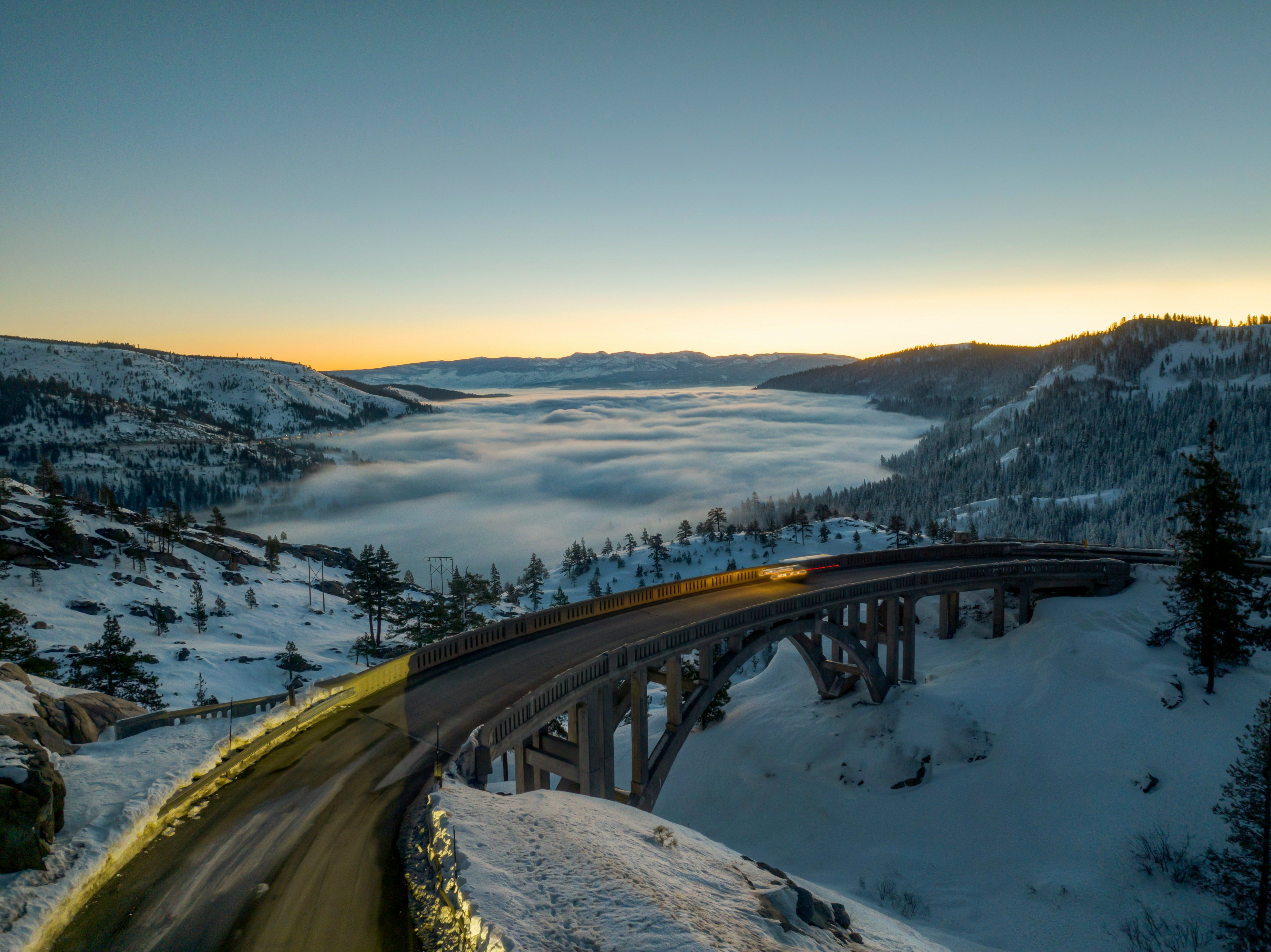 Road and Bridge Going Over Snowy Hills · Free Stock Photo