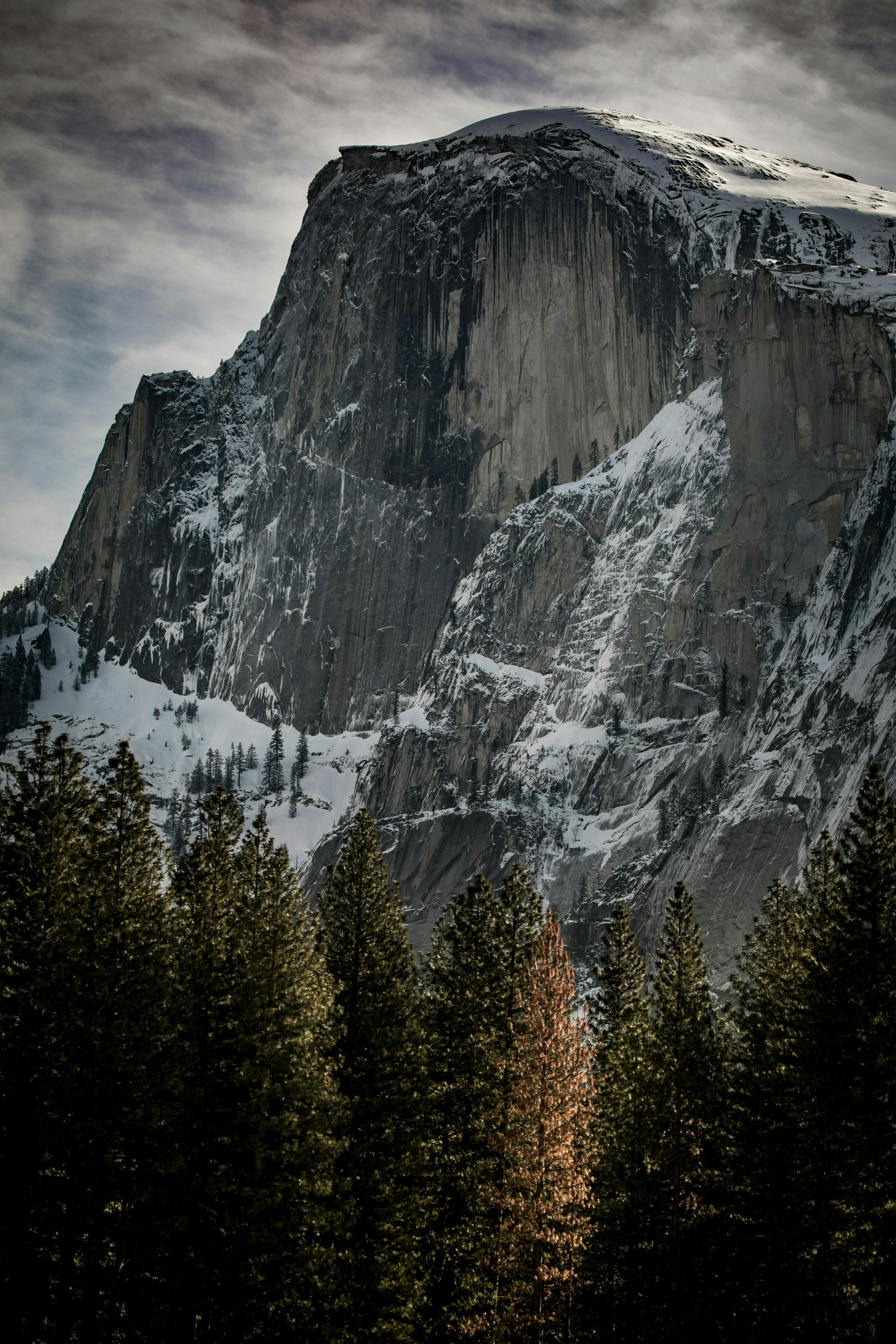 White Waterfalls Between Rocky Mountain during Cloudy Day · Free Stock ...