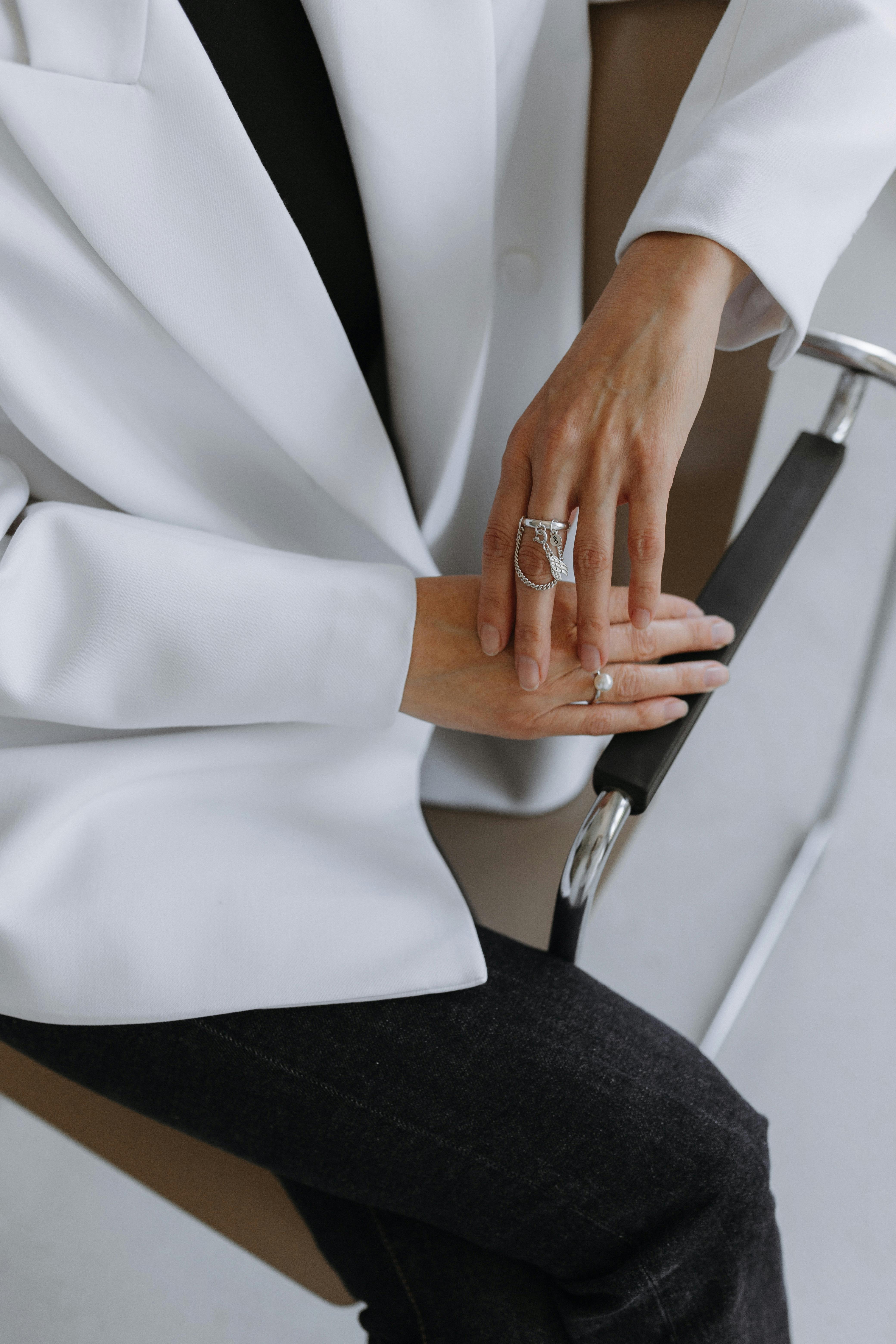 Hands of Woman in White Suit · Free Stock Photo