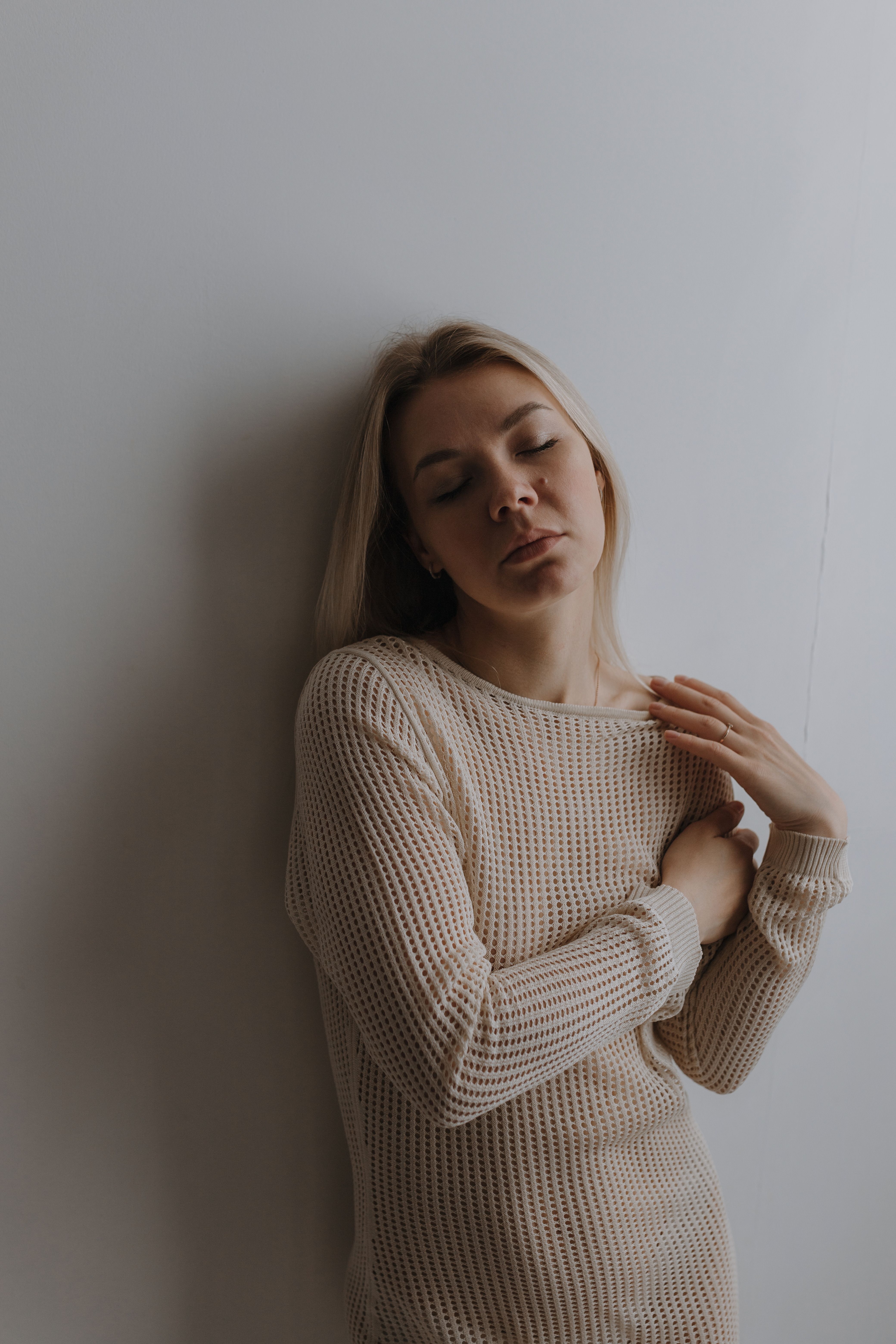 Woman in White Mesh Dress by Wall · Free Stock Photo