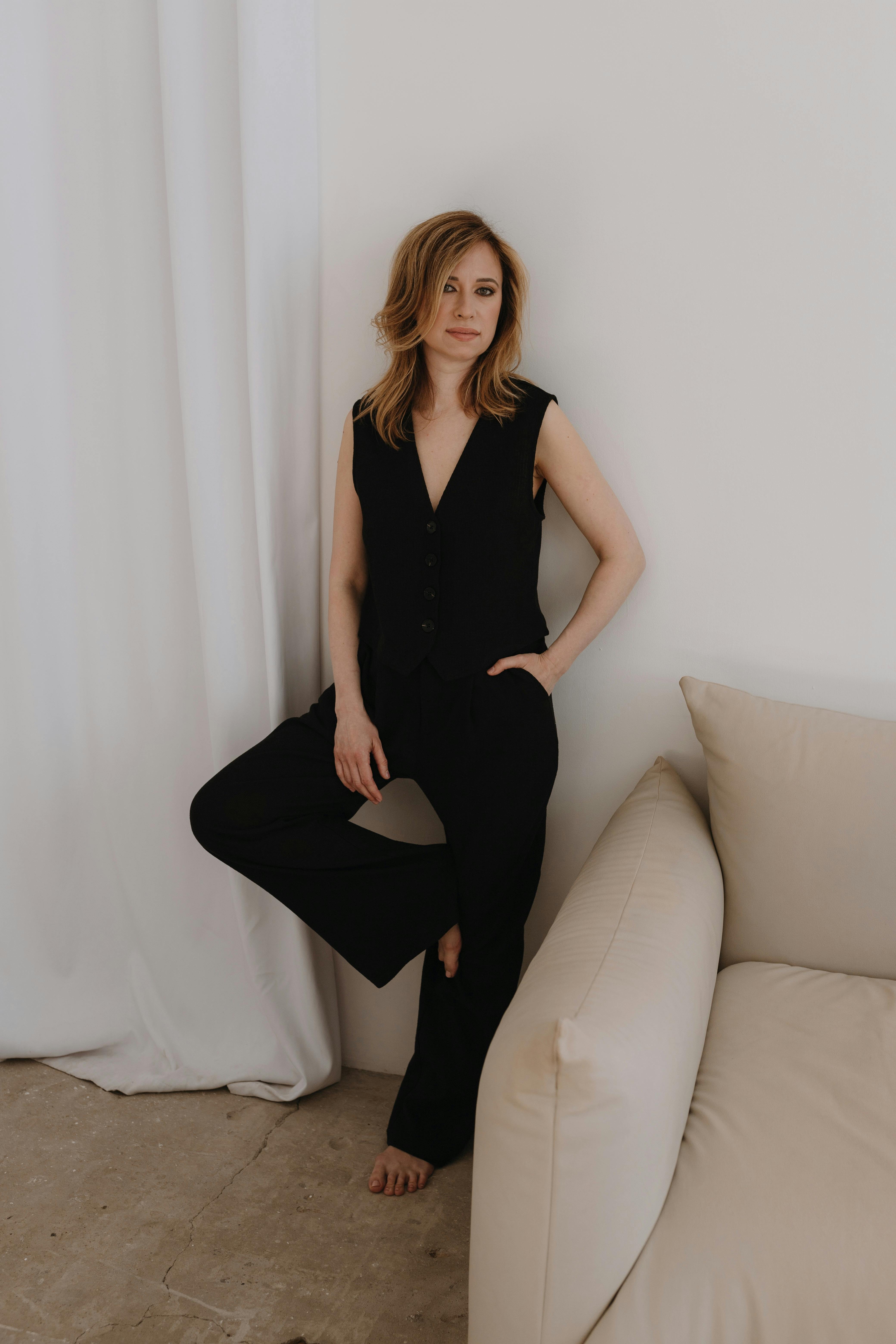 Standing on One Leg Woman in Black Pants and Waistcoat · Free Stock Photo