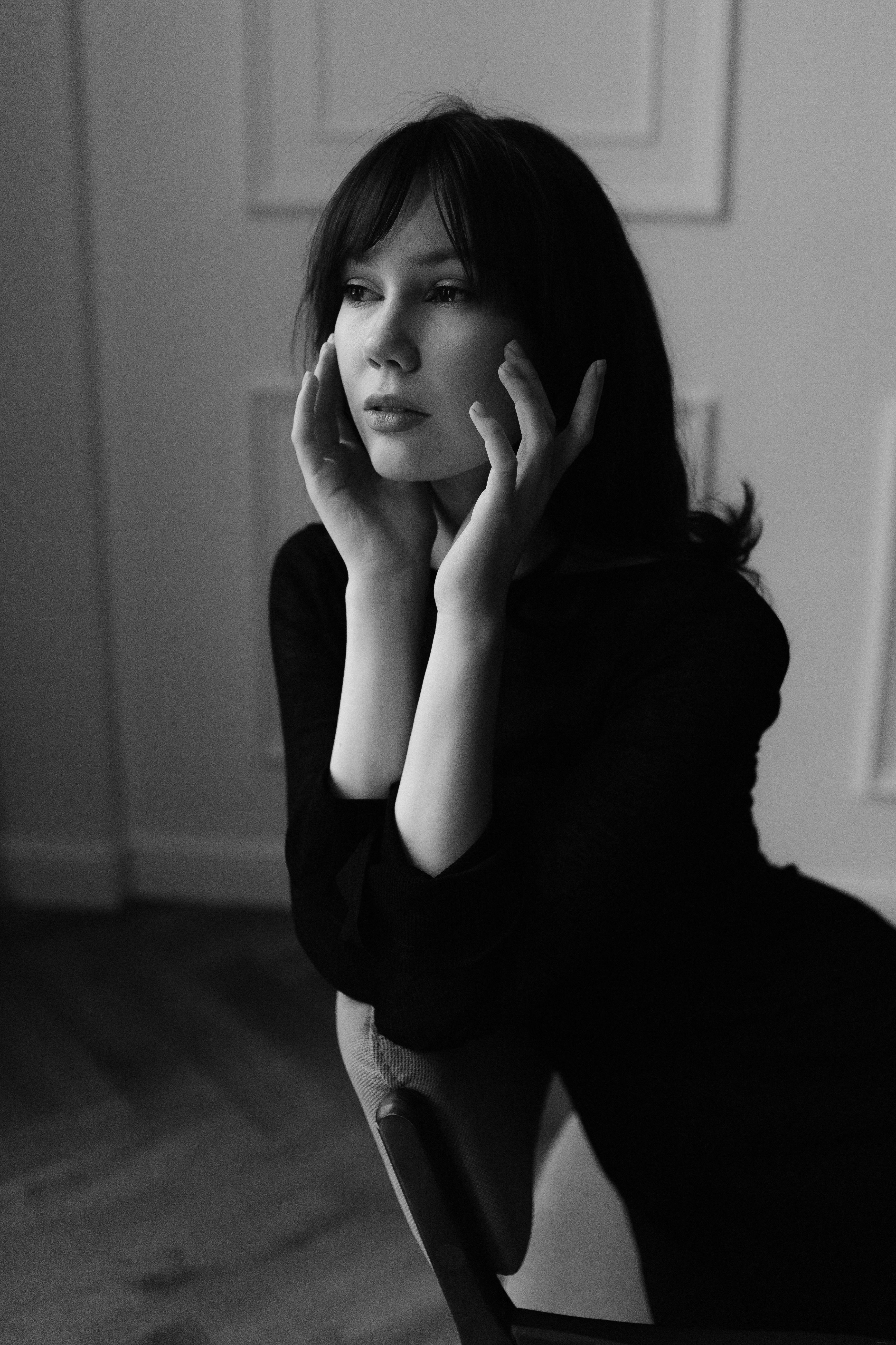 Woman Holding Face in Hands · Free Stock Photo