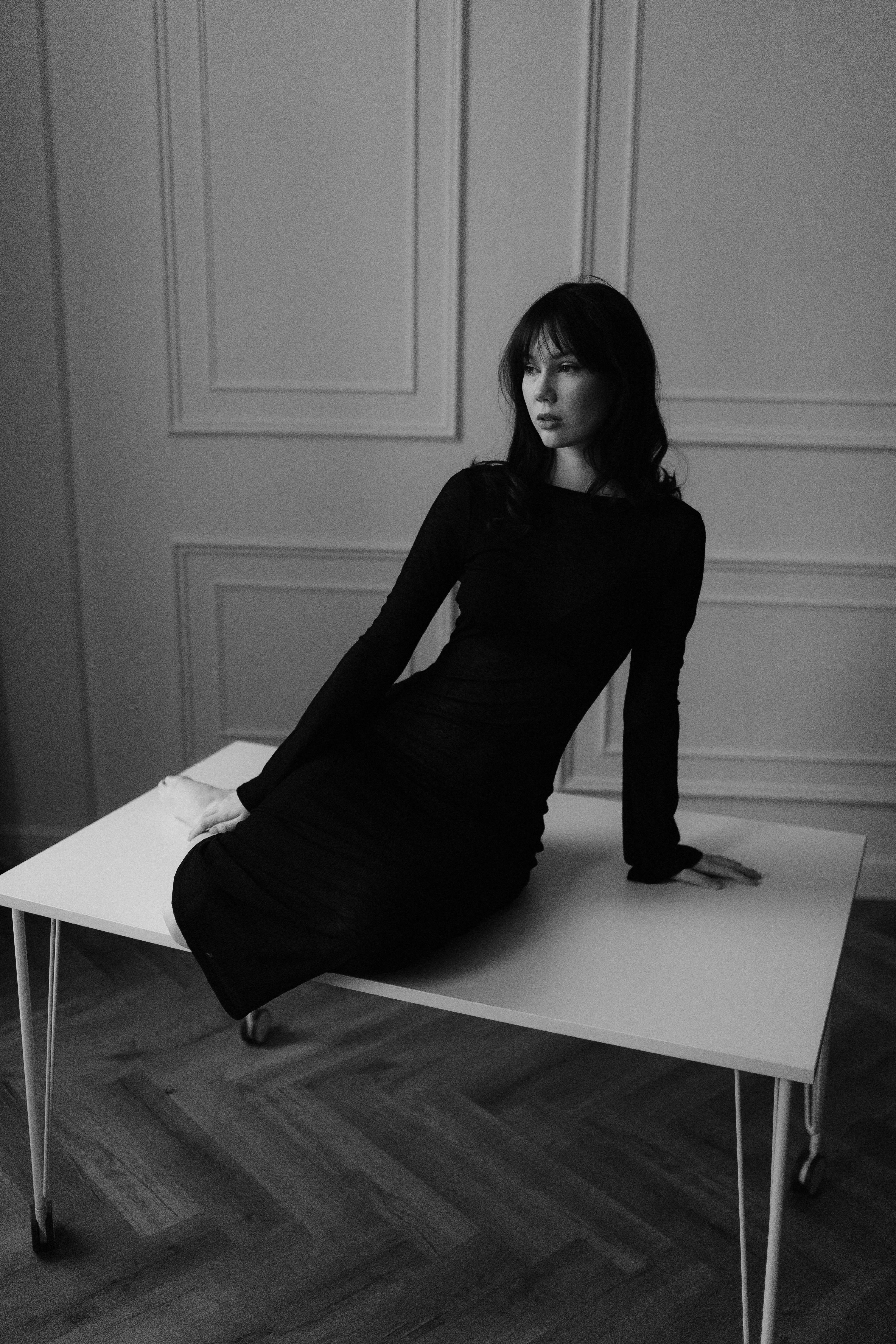 Woman in Dress Sitting on Table · Free Stock Photo