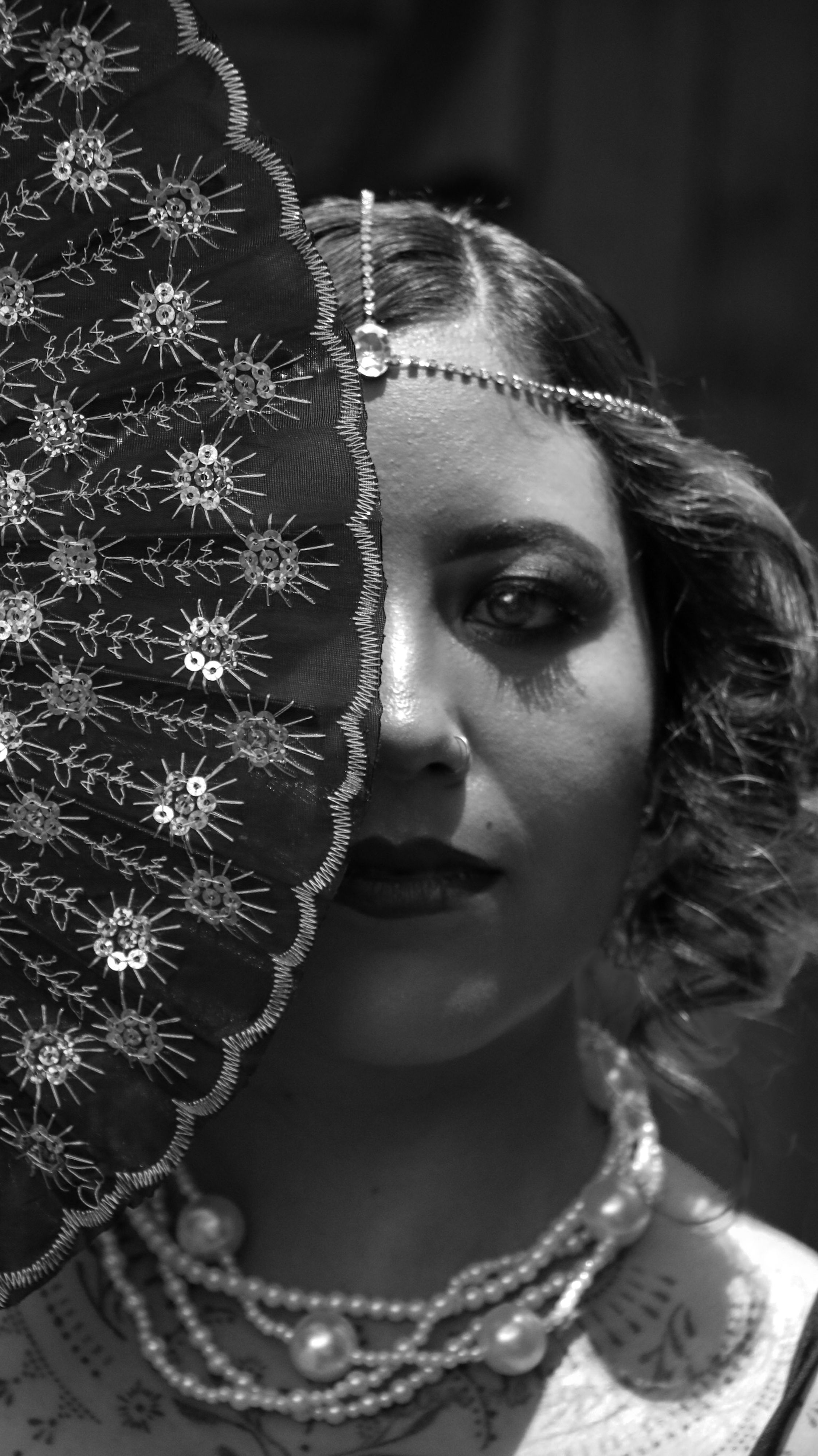Portrait of Woman Holding Fan over Face · Free Stock Photo