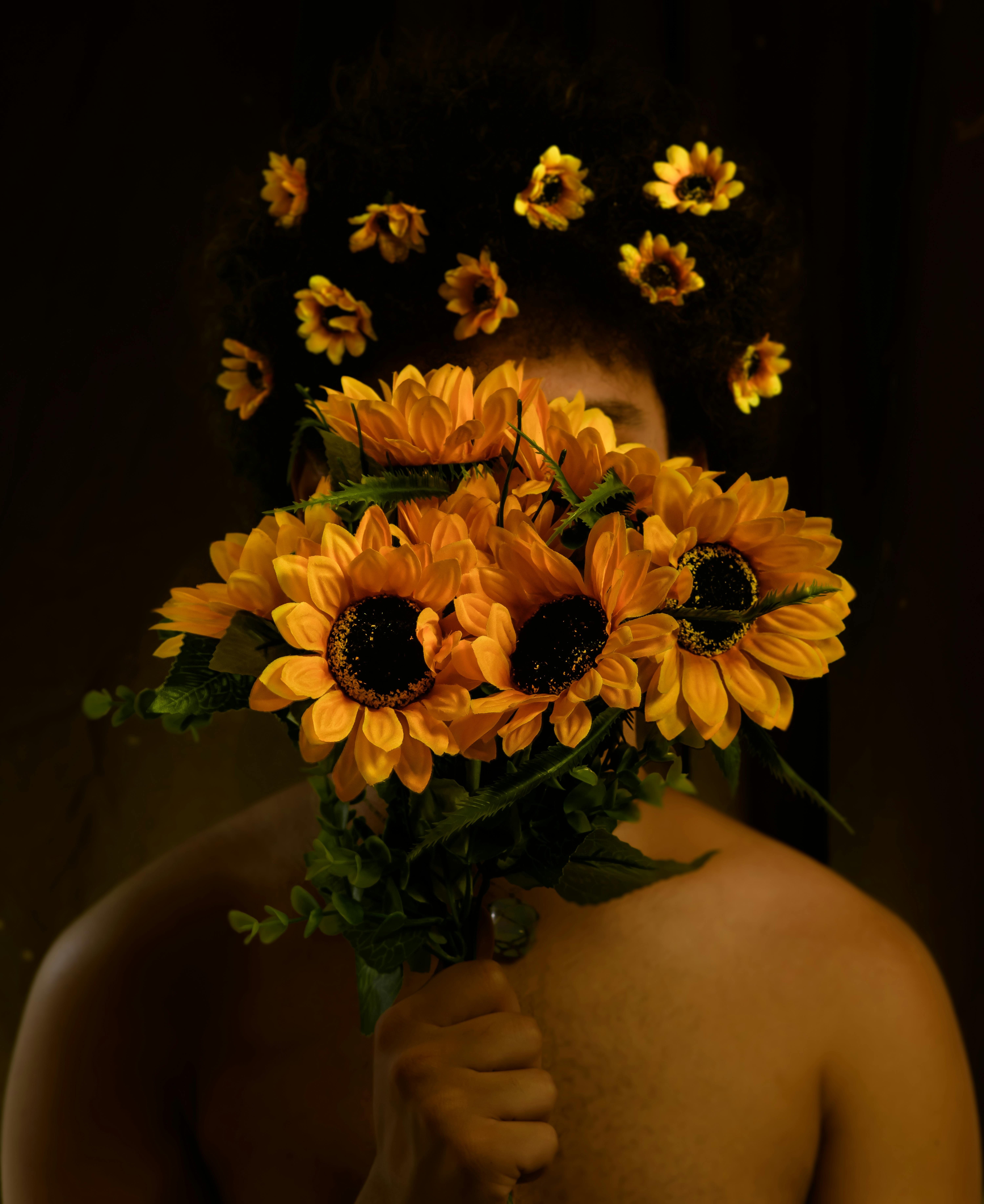 Photo of Person Holding Sunflowers · Free Stock Photo