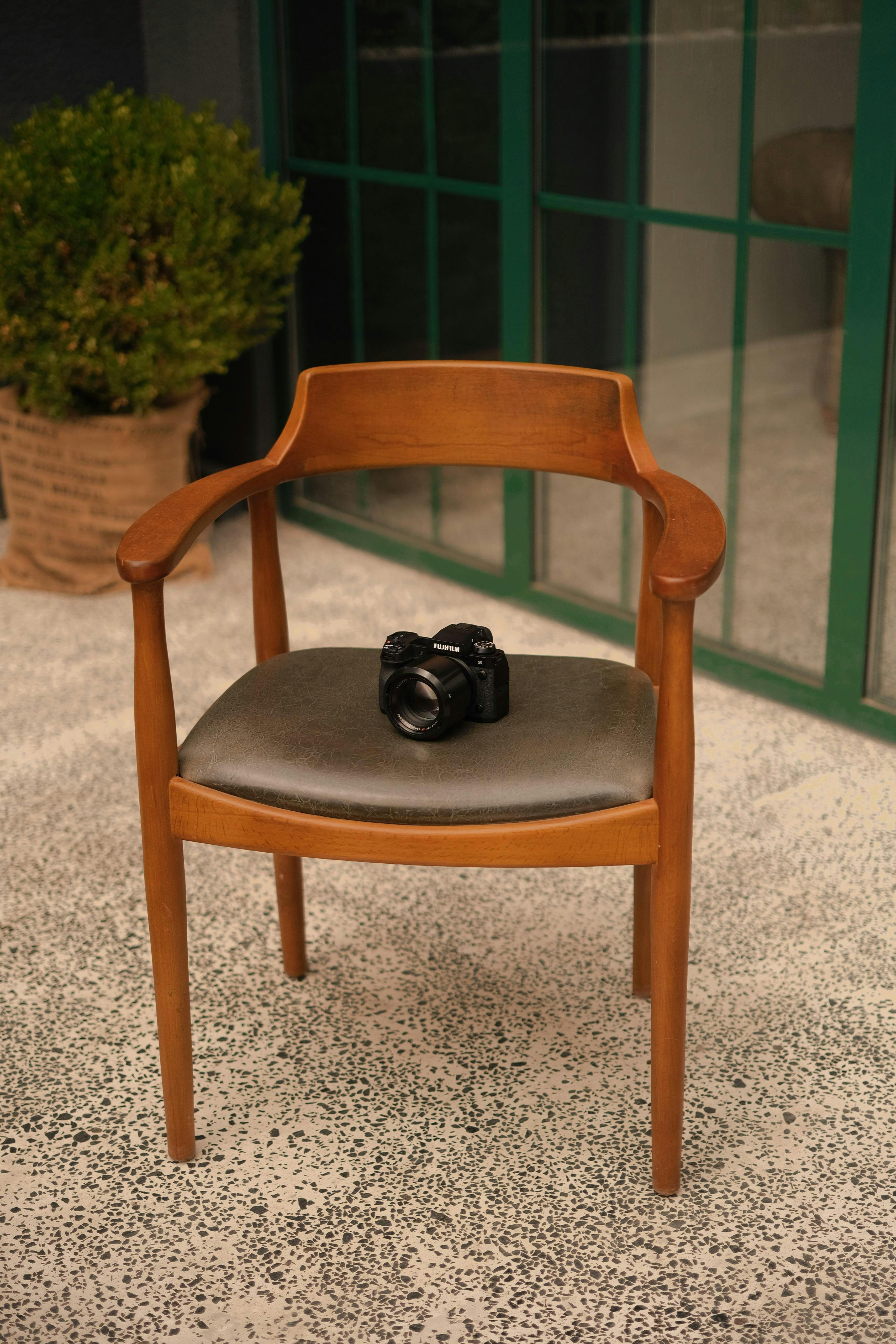 A Camera Lying on a Chair · Free Stock Photo