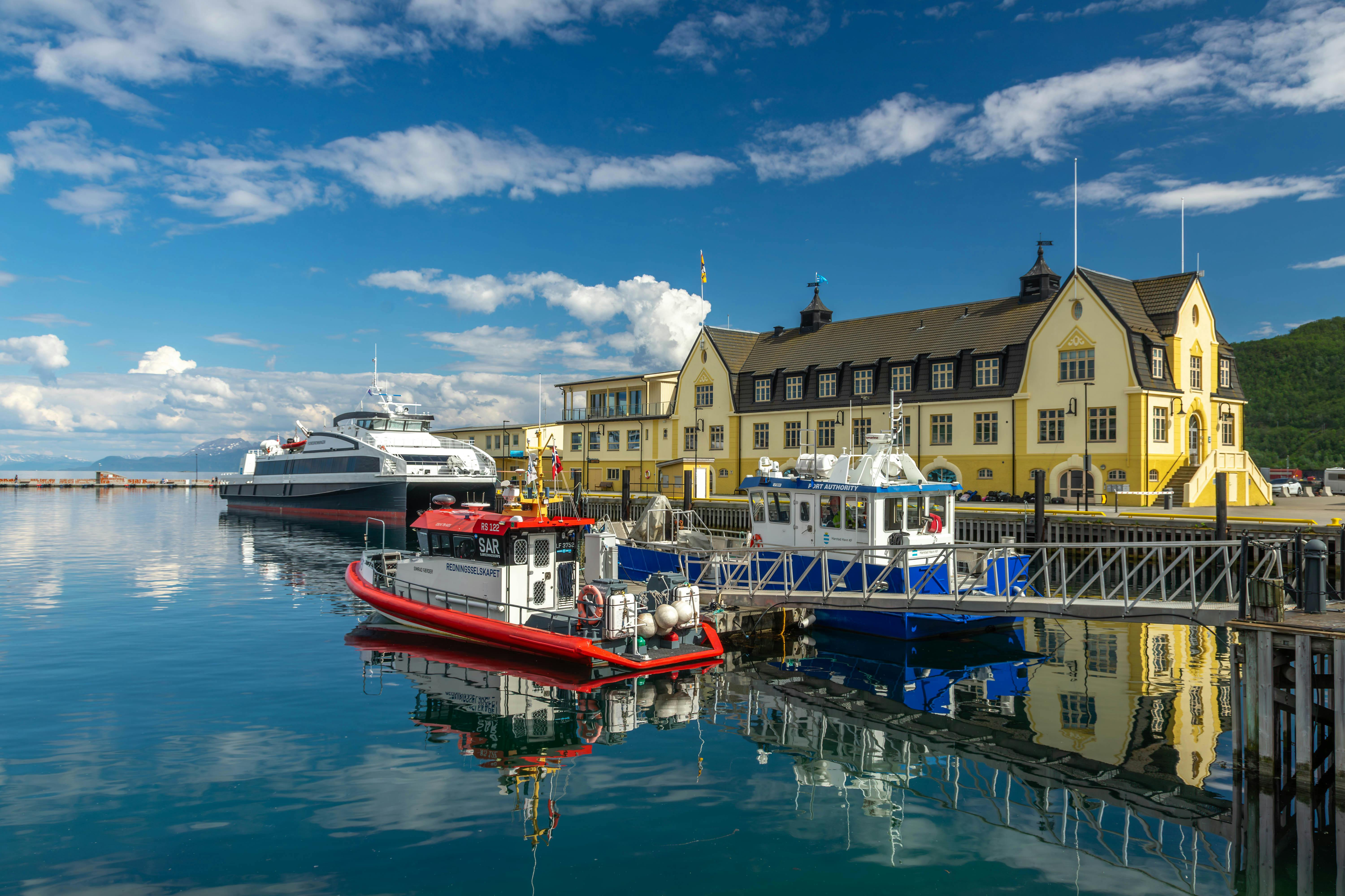 Ferry and Motorboats Moored in Harstad in Norway · Free Stock Photo