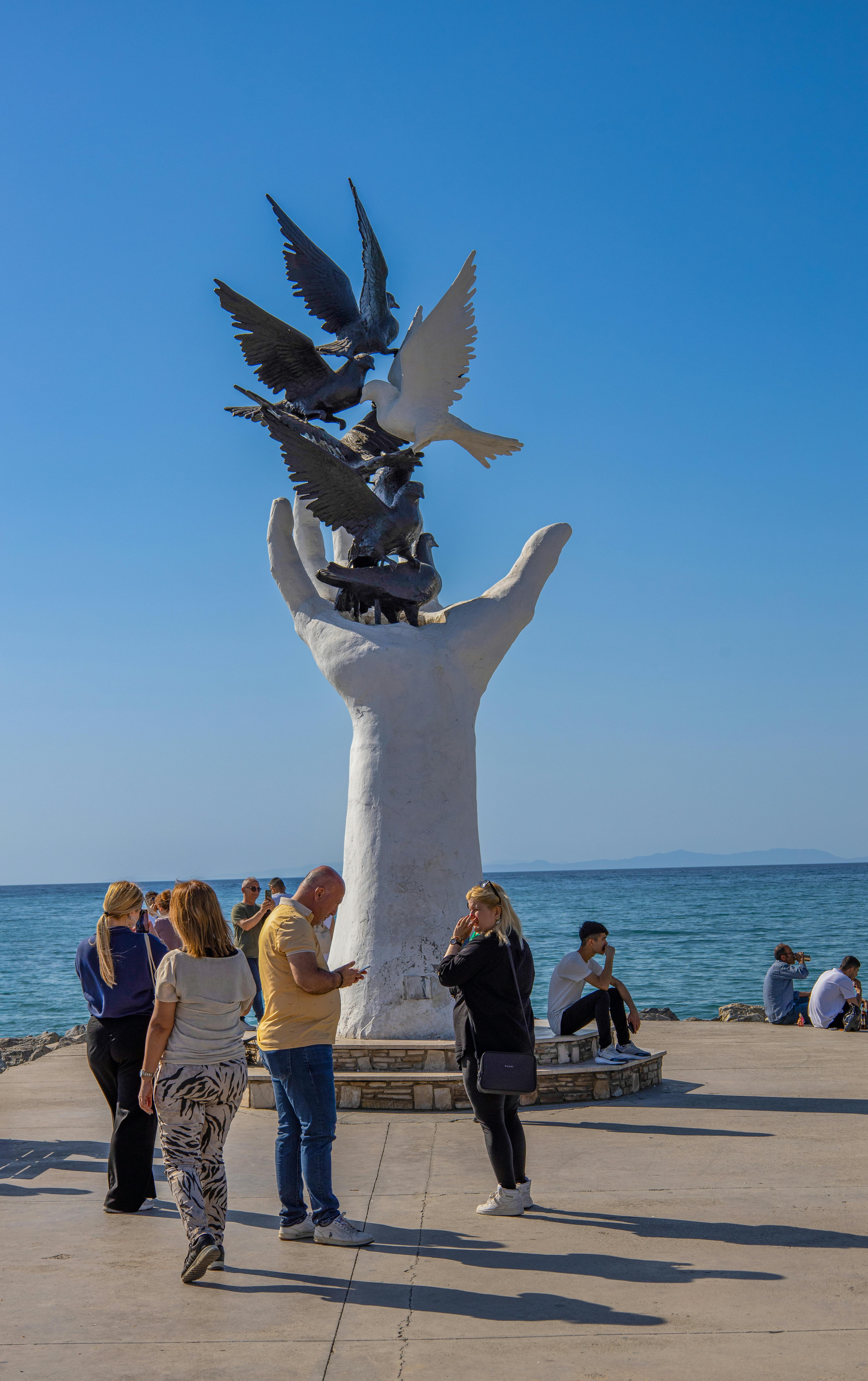 People Standing near the Hand of Peace Sculpture in Kusadasi, Aydin ...