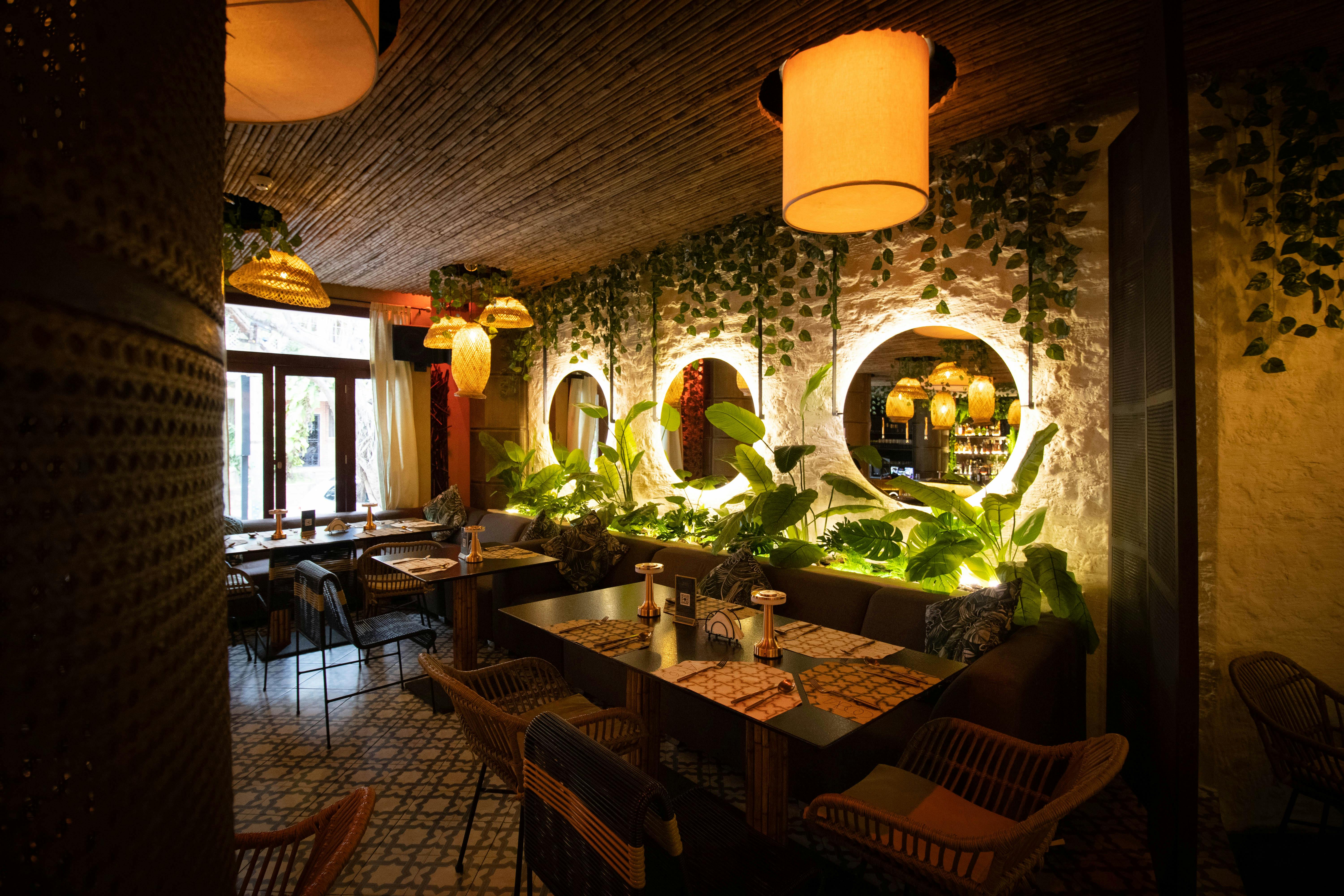 Round Illuminated Mirrors on Wall in Restaurant · Free Stock Photo