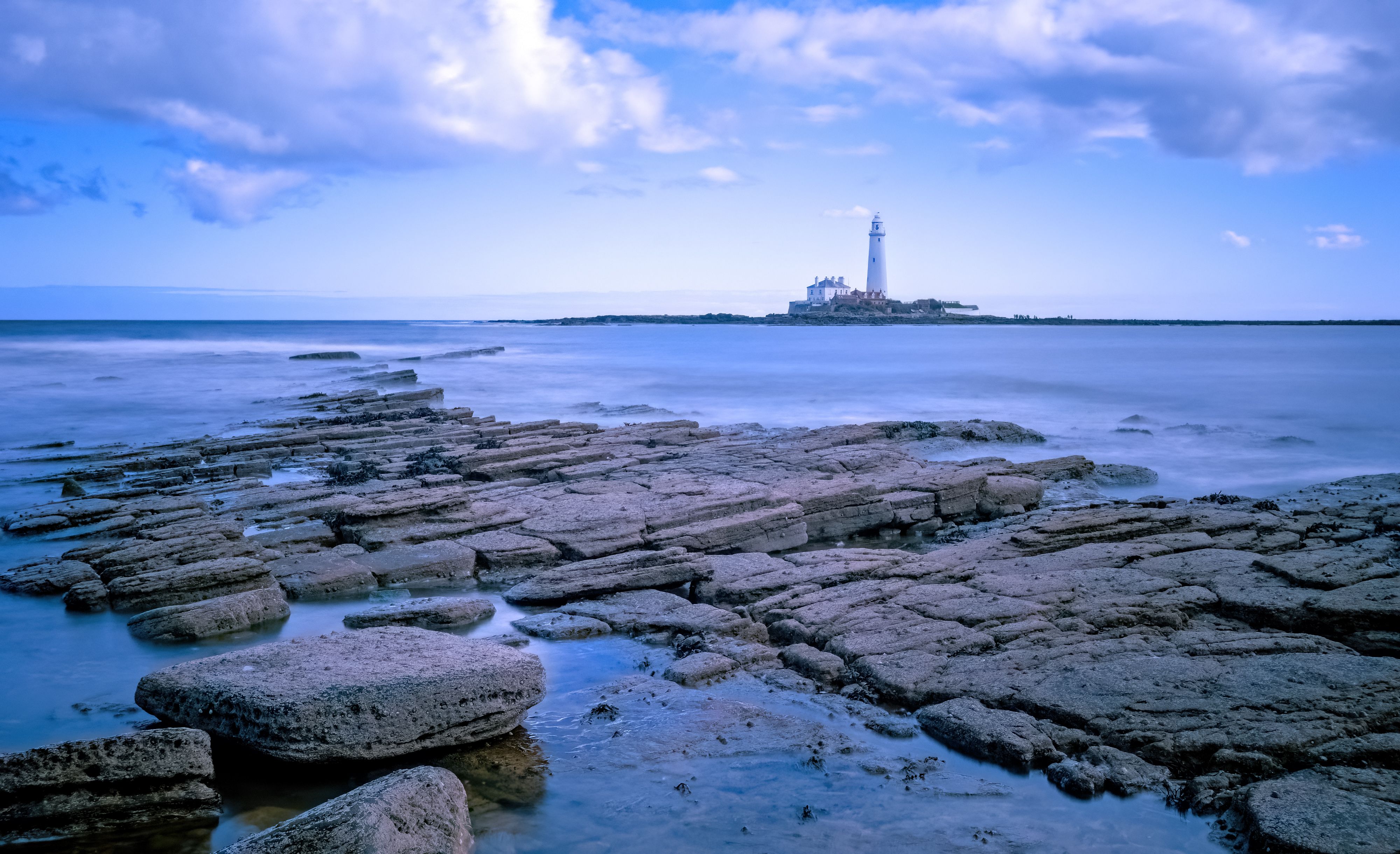 Light House Near Rock Formation Body of Water · Free Stock Photo