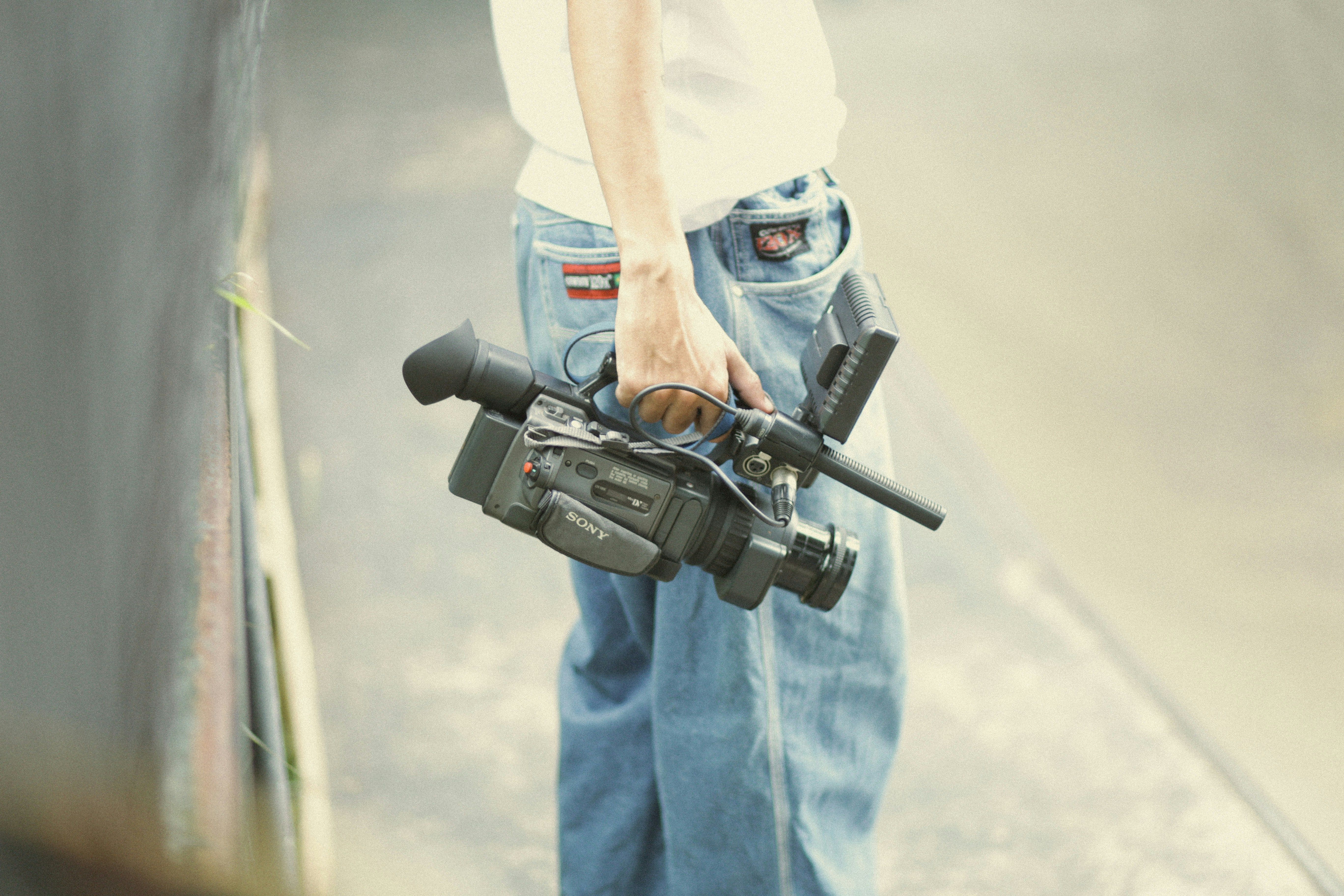 Man Standing with Camera · Free Stock Photo