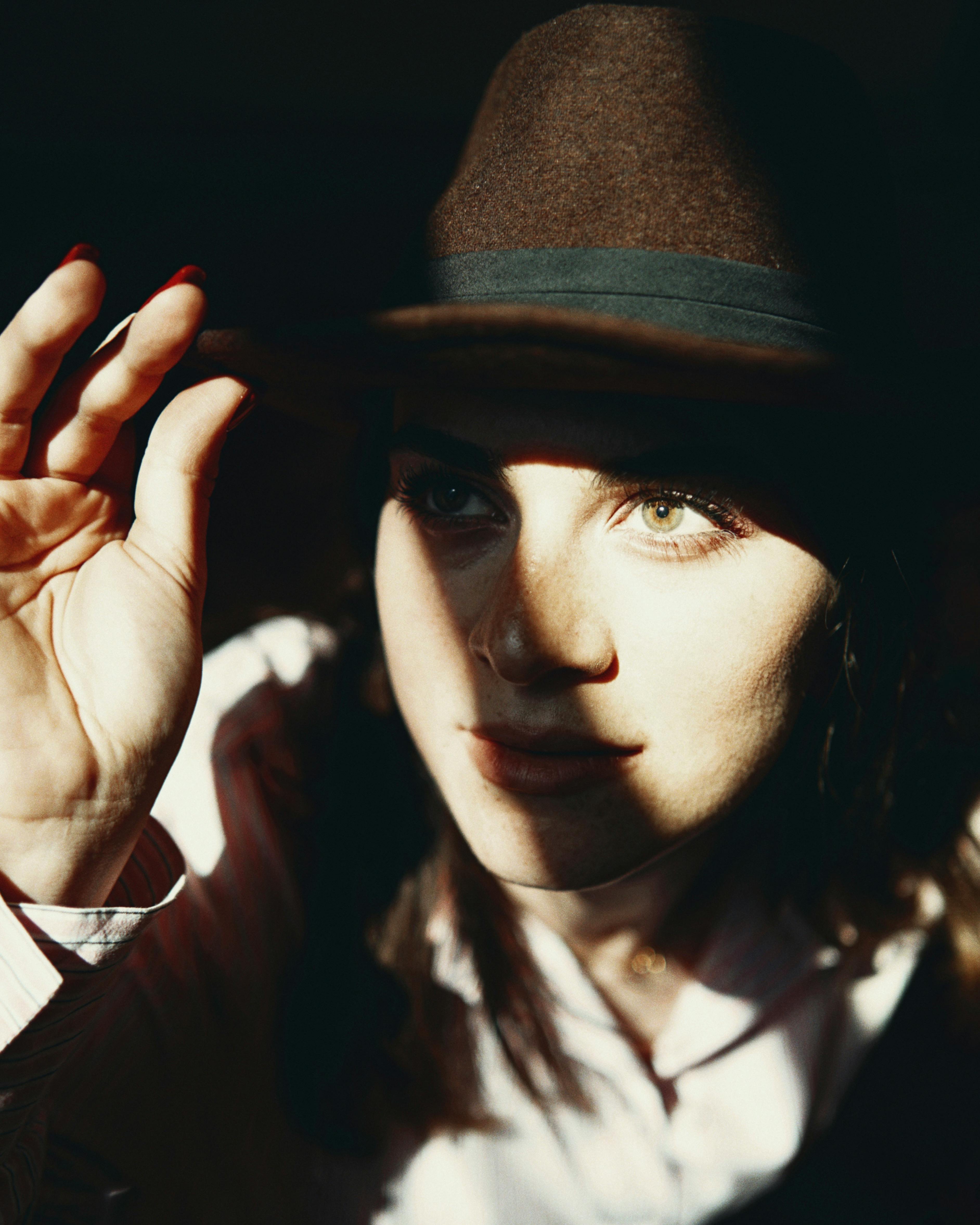 Sunlit Face of Woman in Hat · Free Stock Photo