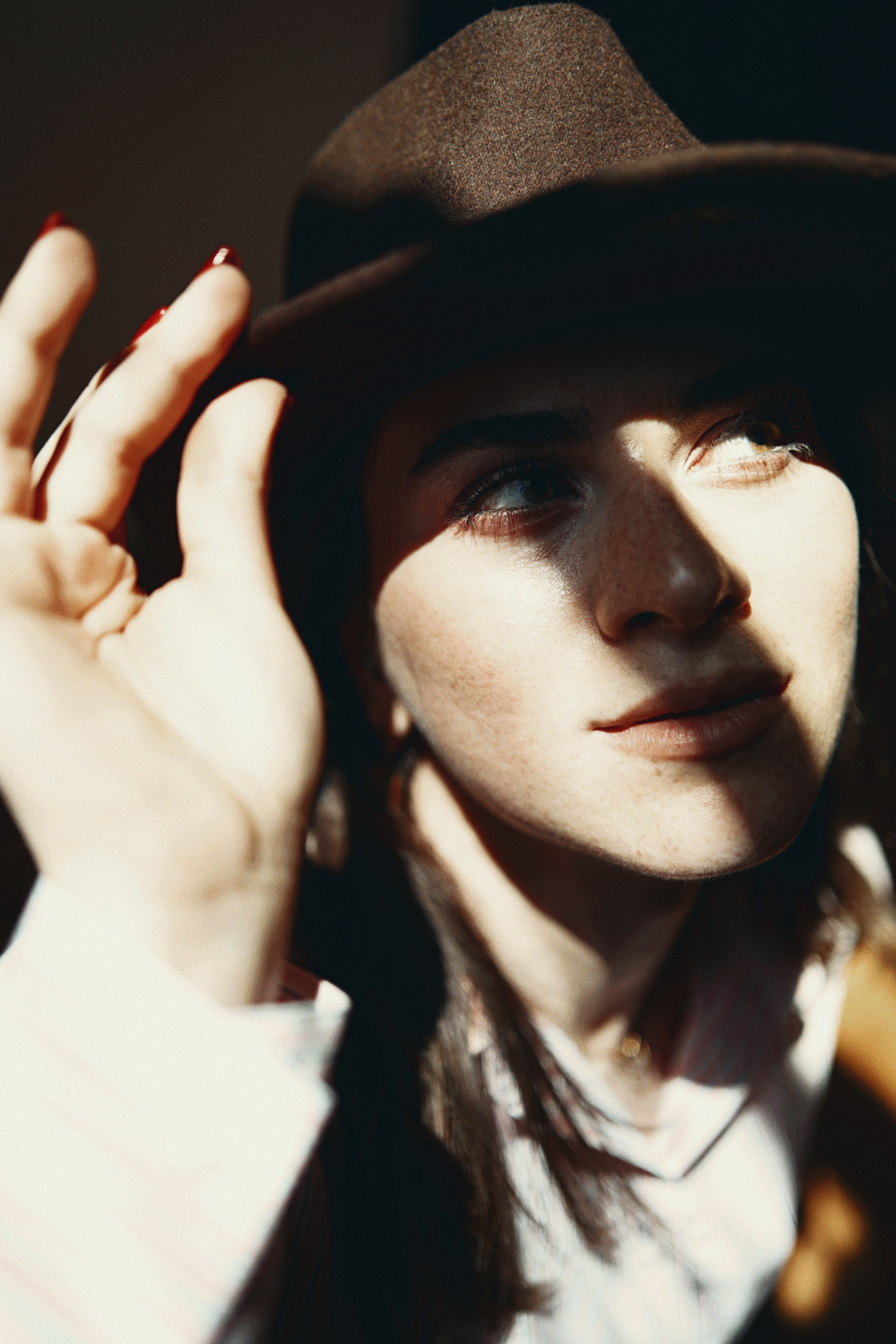 Sunlit Woman Face in Hat · Free Stock Photo